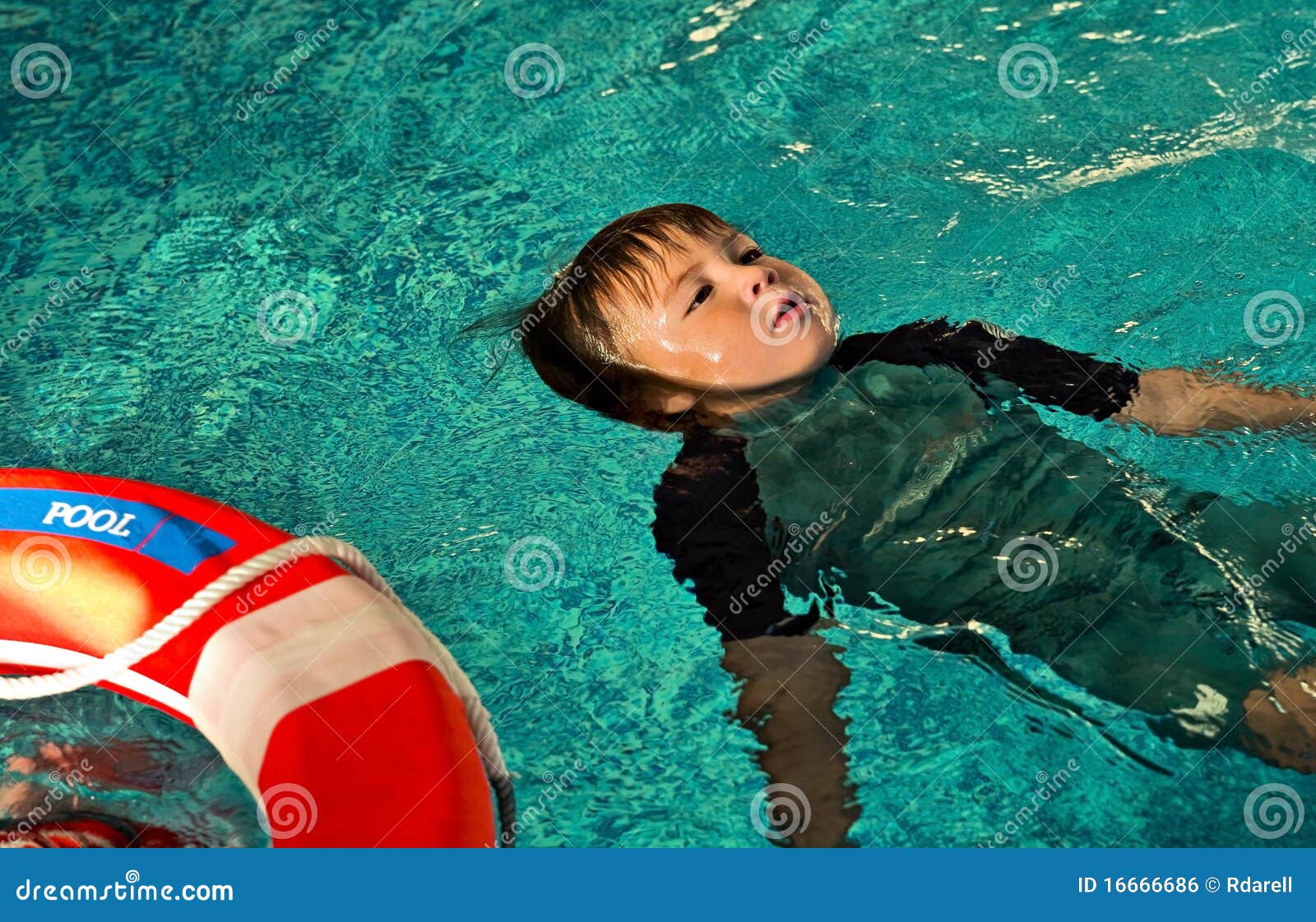 Boy Doing Lifesaving Floating On Water. Stock Photo - Image: 16666686