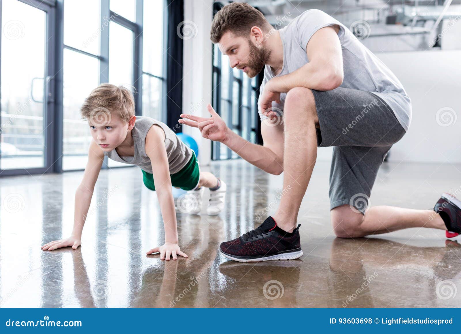 Boy Doing Push Ups with Coach Stock Photo - Image of trainer, child ...
