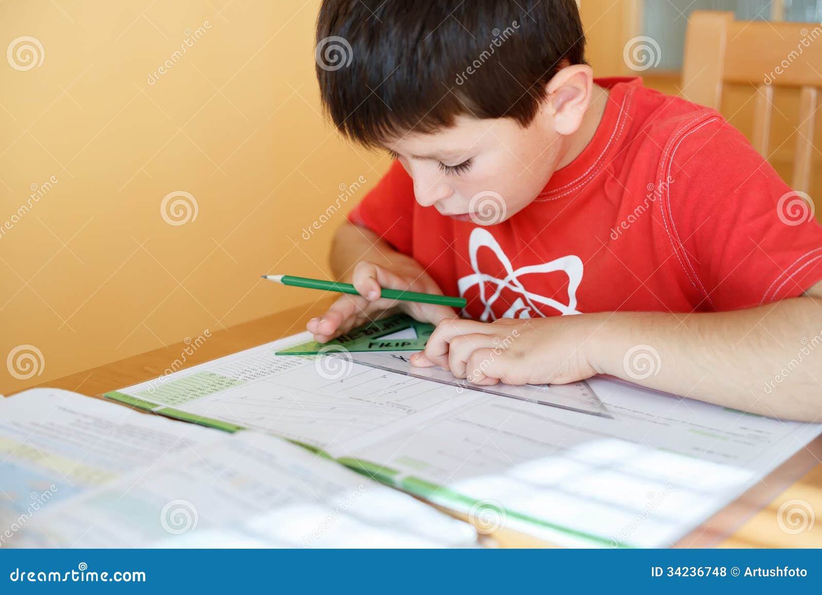 Boy doing school homework stock photo. Image of home - 34236748