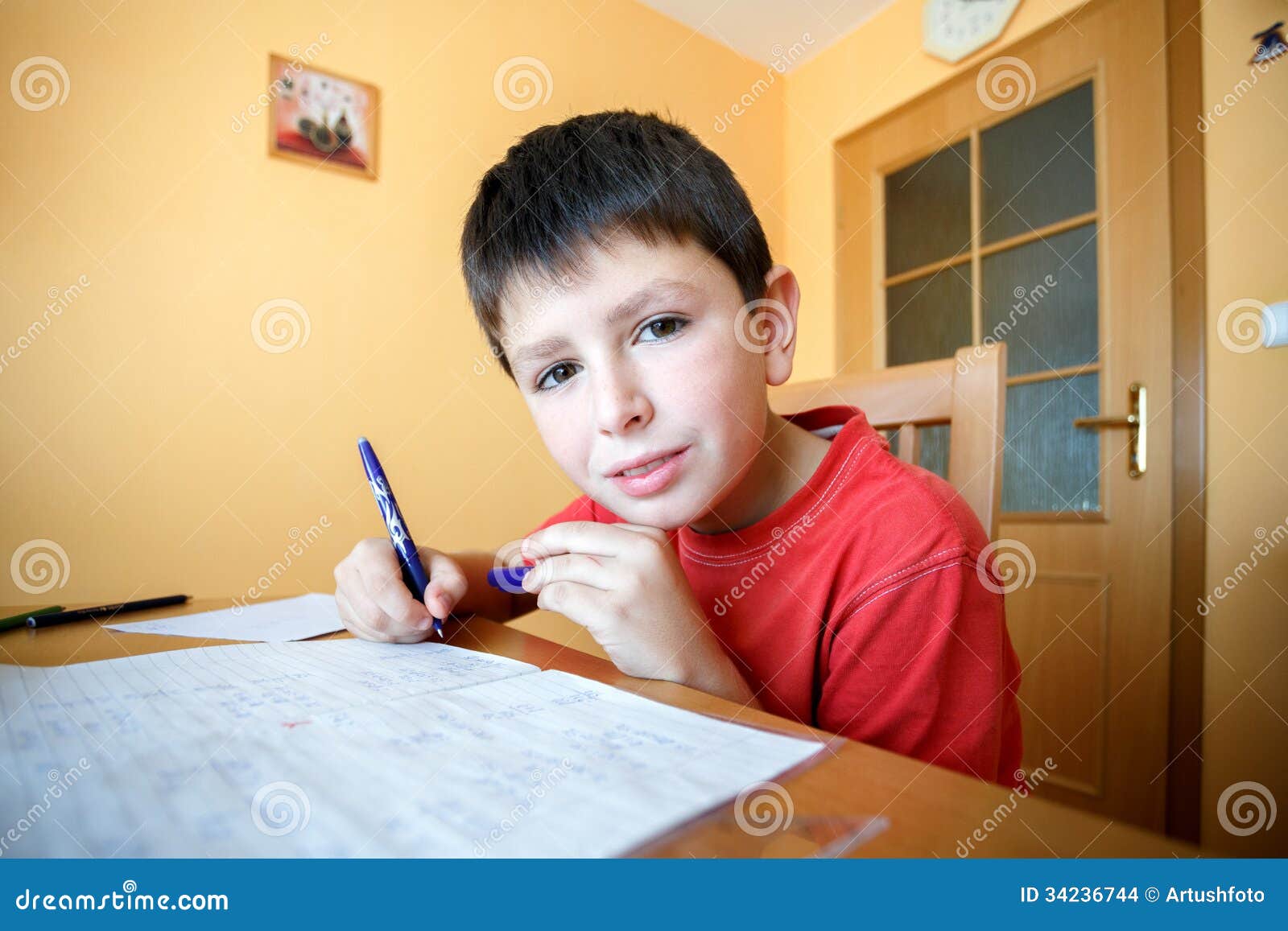 Boy doing school homework stock photo. Image of expression - 34236744