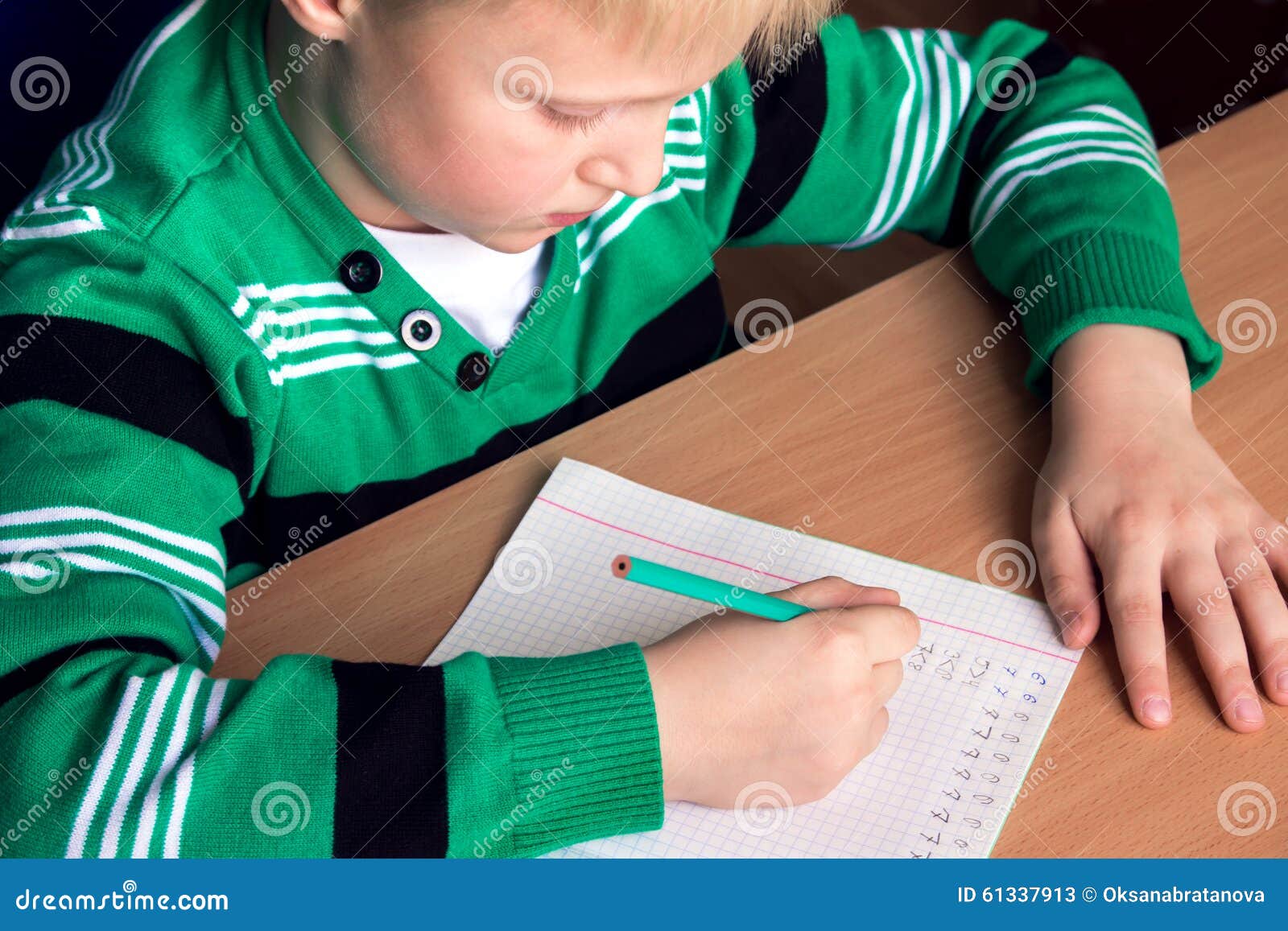 Boy doing school homework stock image. Image of copybook - 61337913