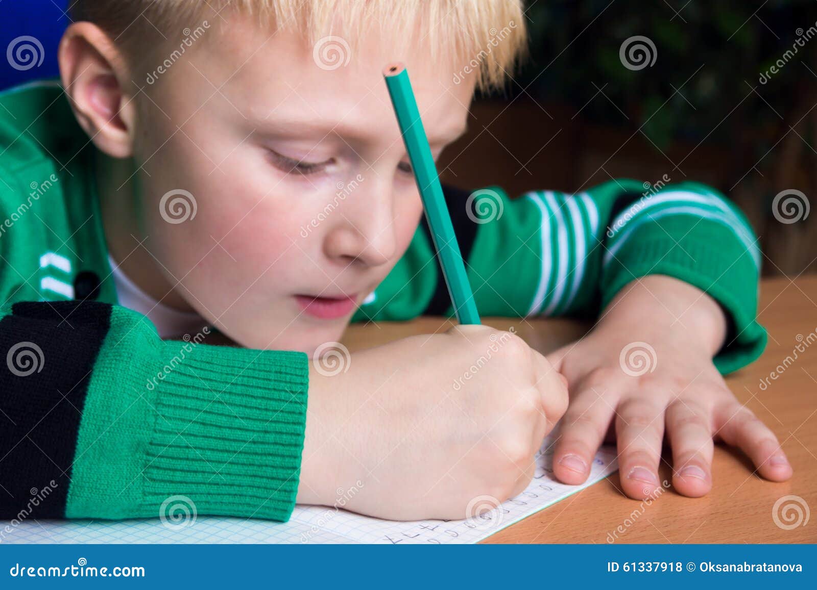 Boy doing school homework stock photo. Image of sitting - 61337918