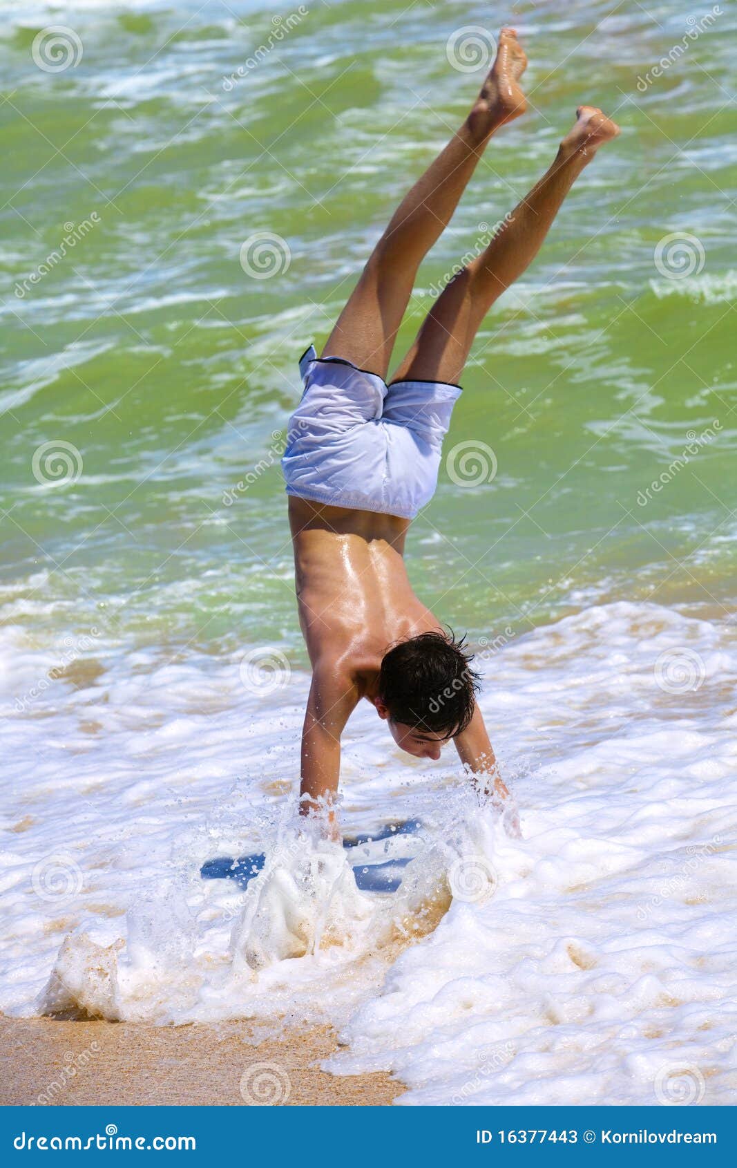 Boy Doing Somersaults on Seacoast Stock Image - Image of enjoying ...