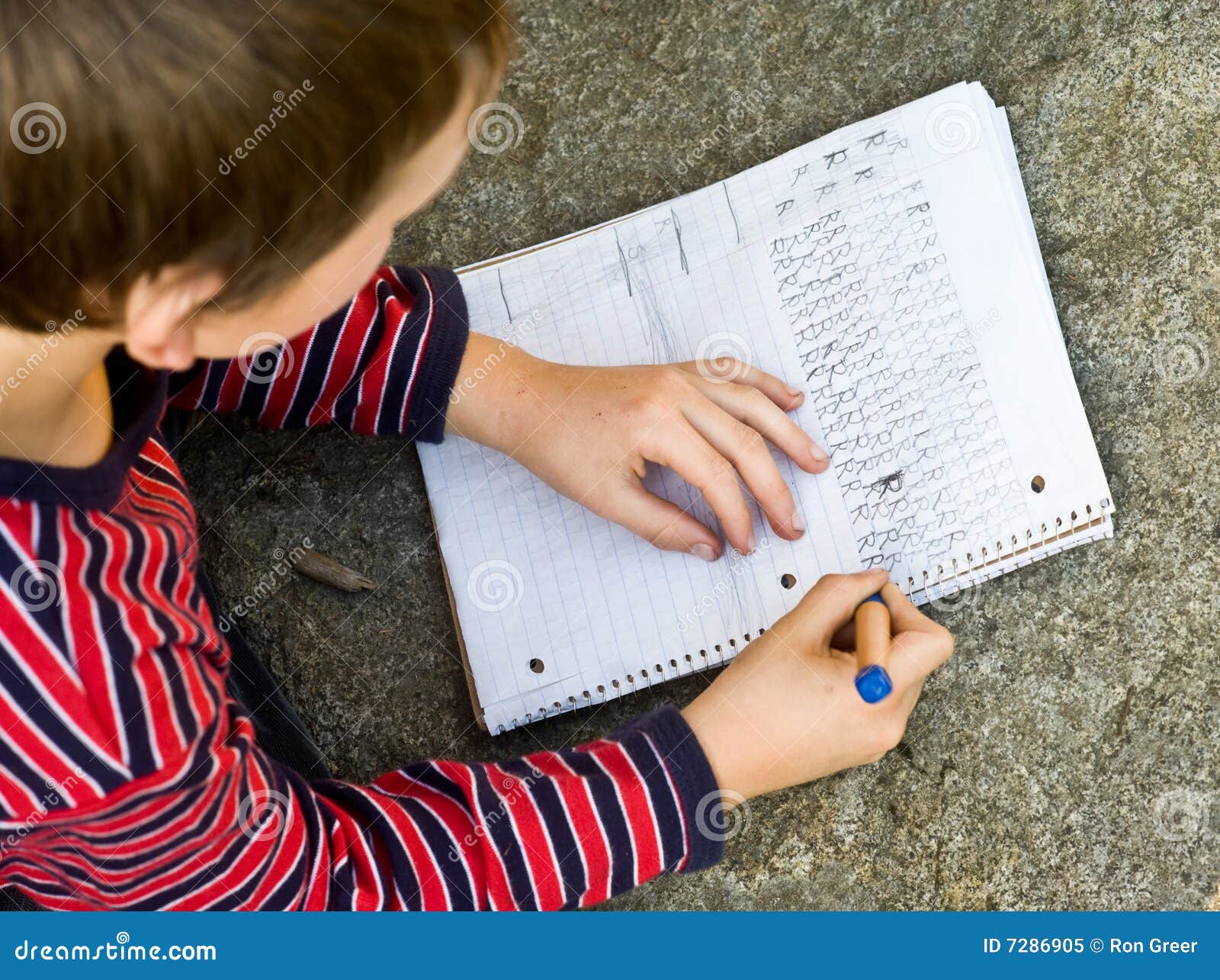 Boy doing writing homework stock image. Image of education - 7286905