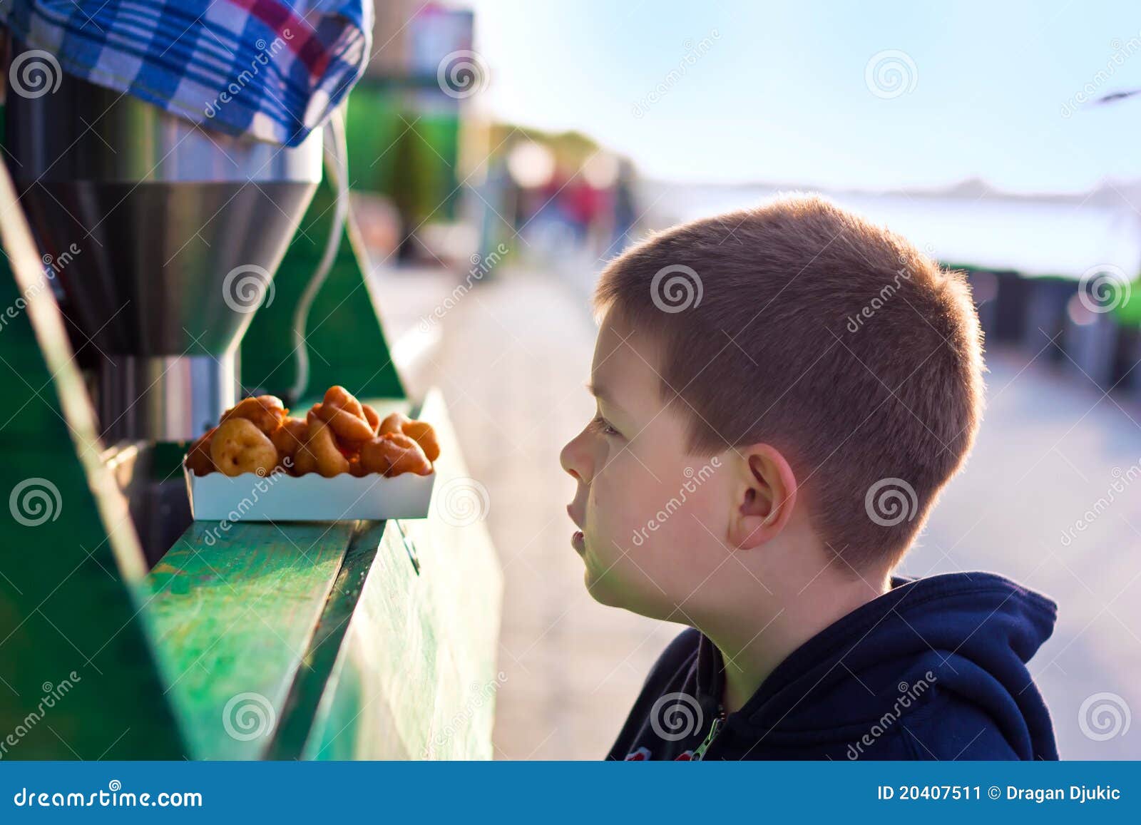Boy with donuts stock image. Image of donuts, promanade - 20407511