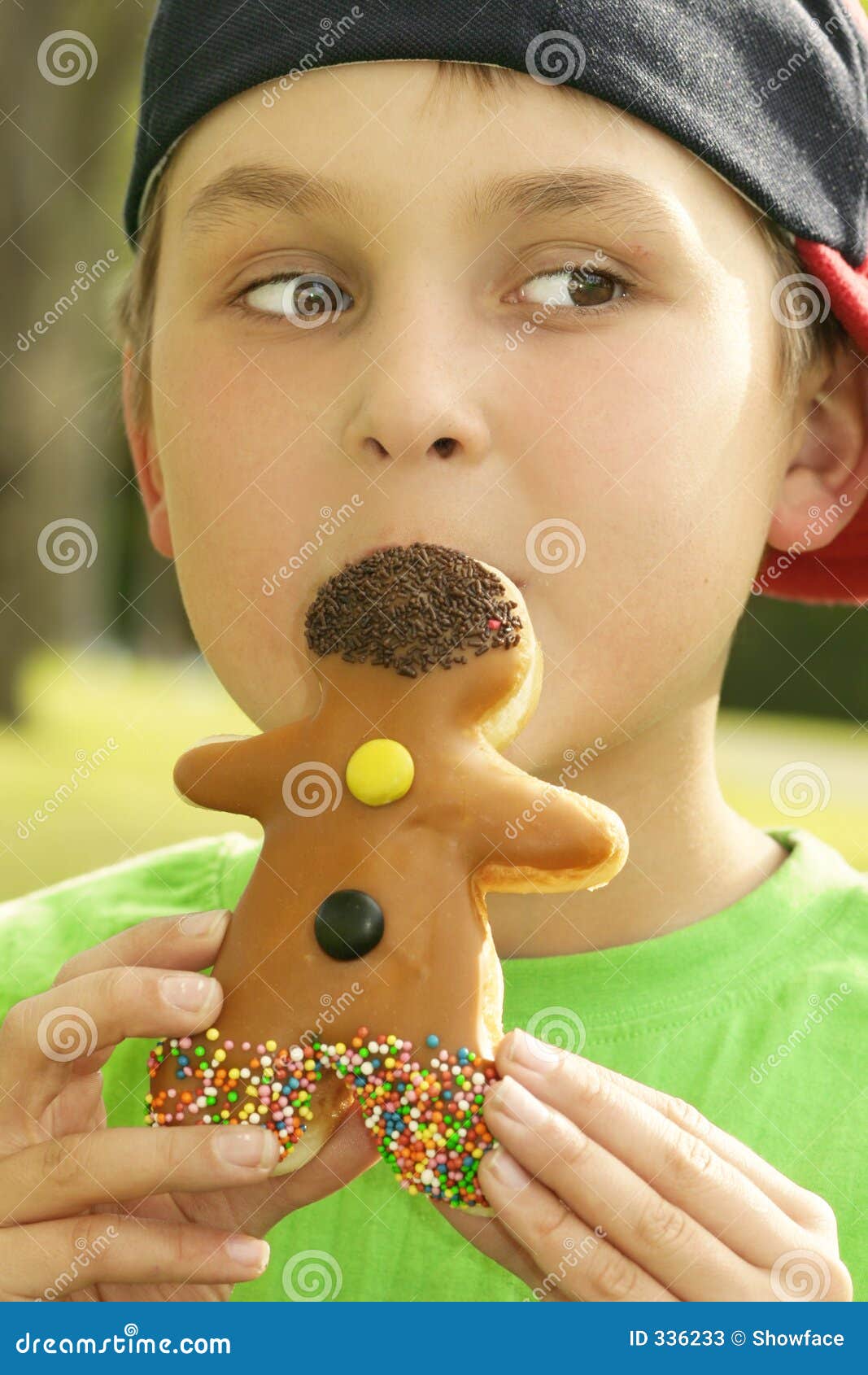 Boy with a dough-nut man stock image. Image of dessert - 336233