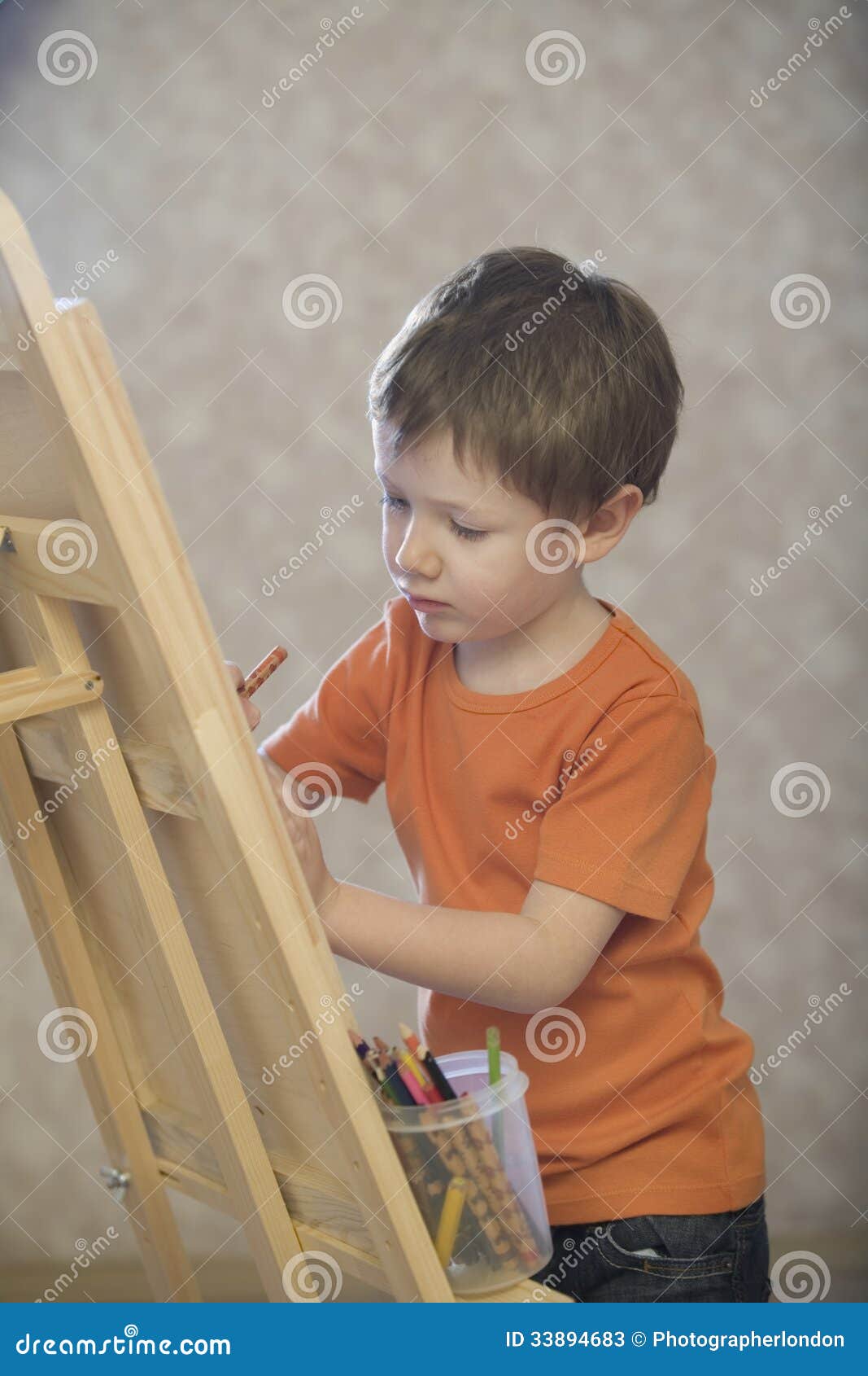 Boy Drawing on Canvas stock image. Image of easel, painting - 33894683