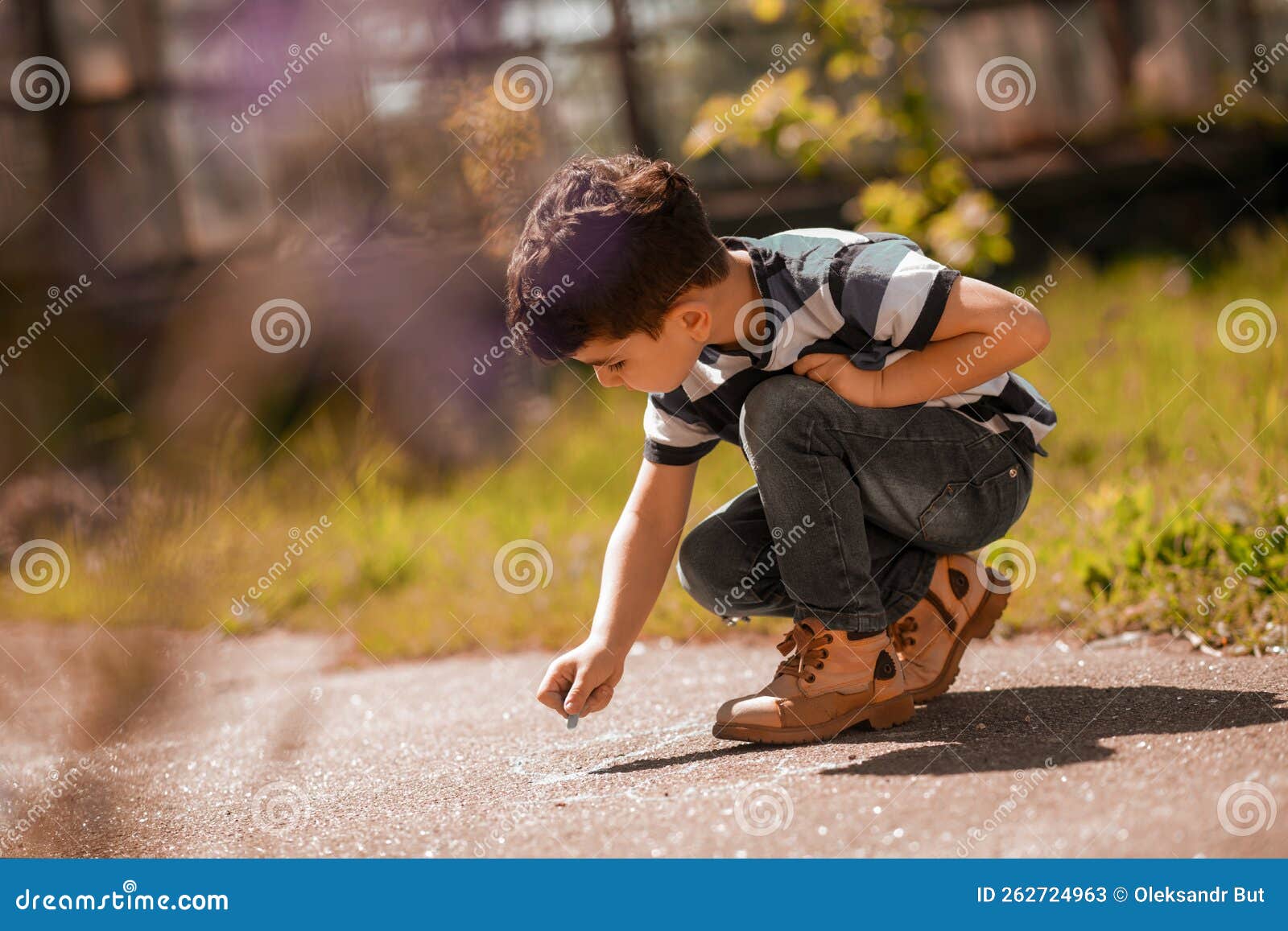 Boy Drawing Something on the Ground Stock Image - Image of nature ...