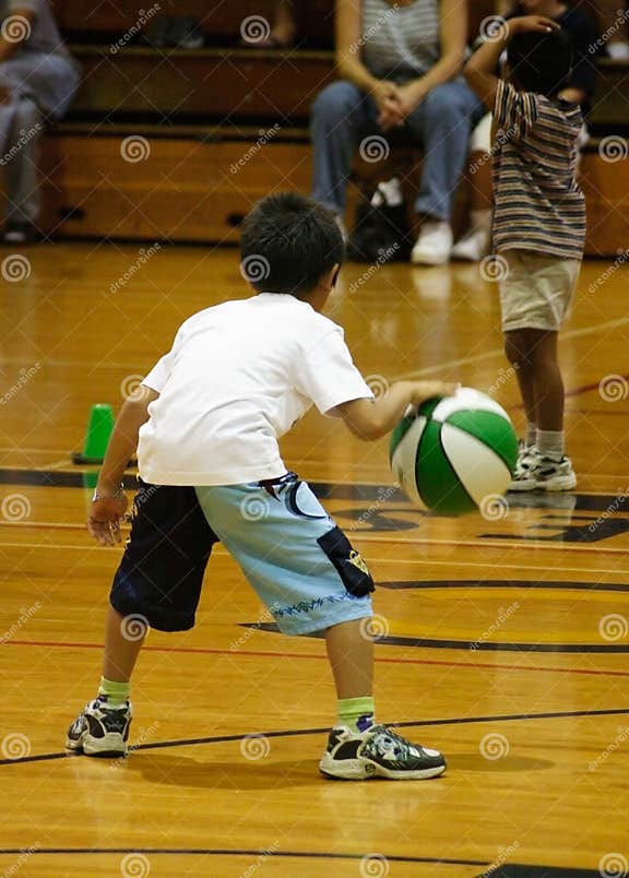 Boy dribbling basketball stock photo. Image of bounce, stance - 187582