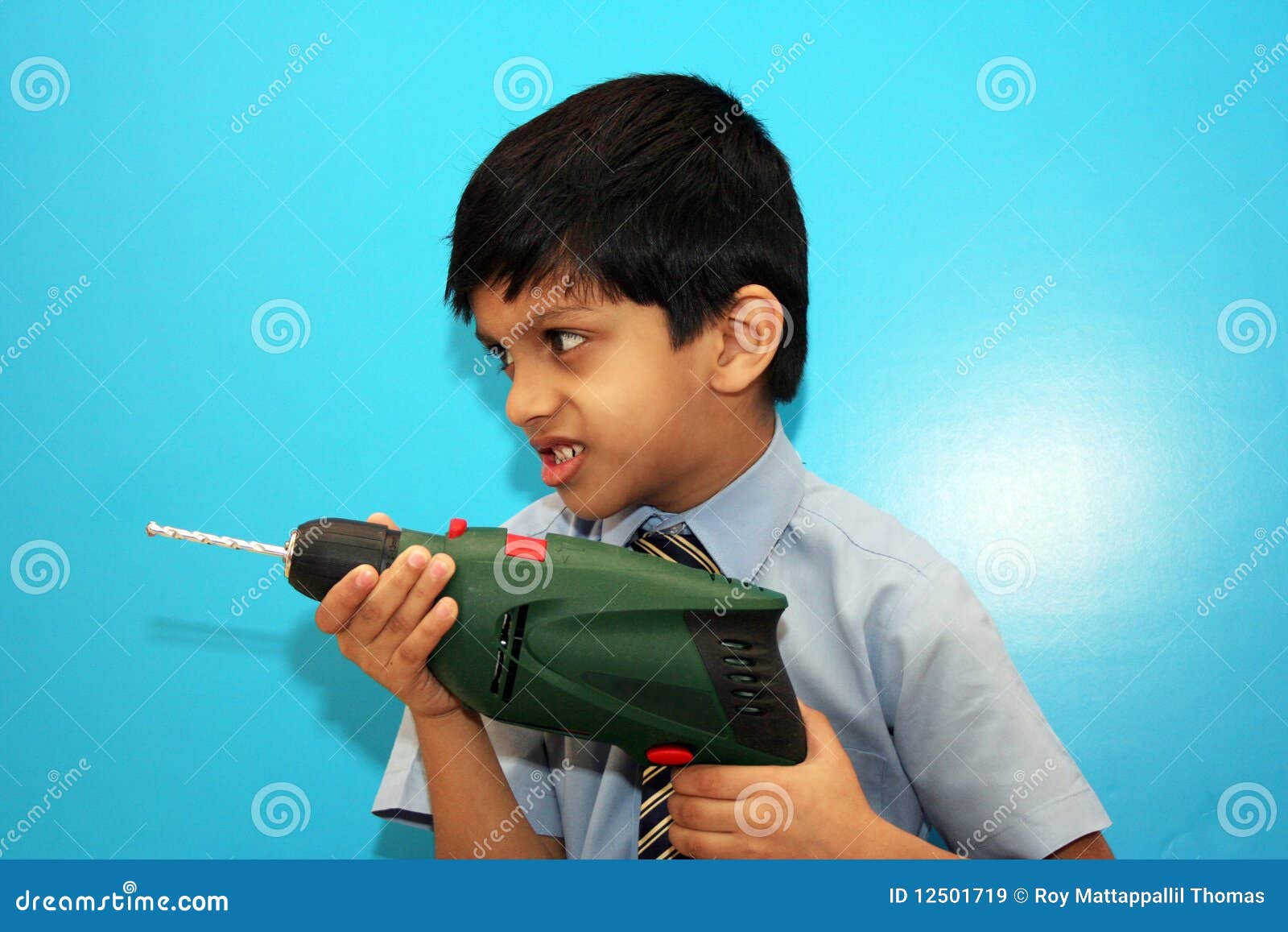 Boy with drilling machine stock image. Image of power - 12501719