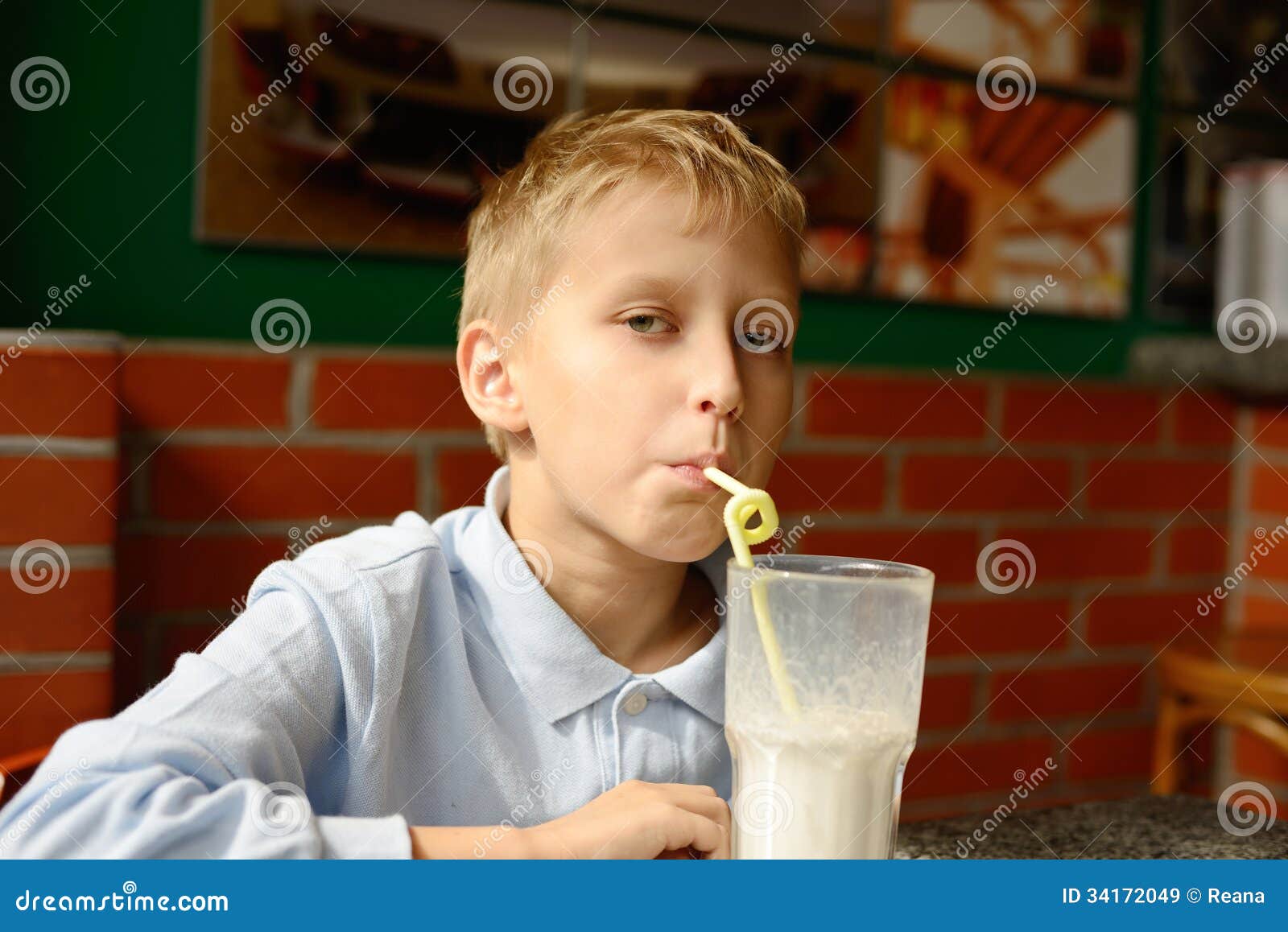 Boy drinking milkshake stock image. Image of face, child - 34172049