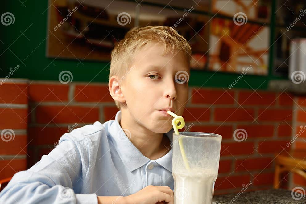 Boy drinking milkshake stock image. Image of face, child - 34172049