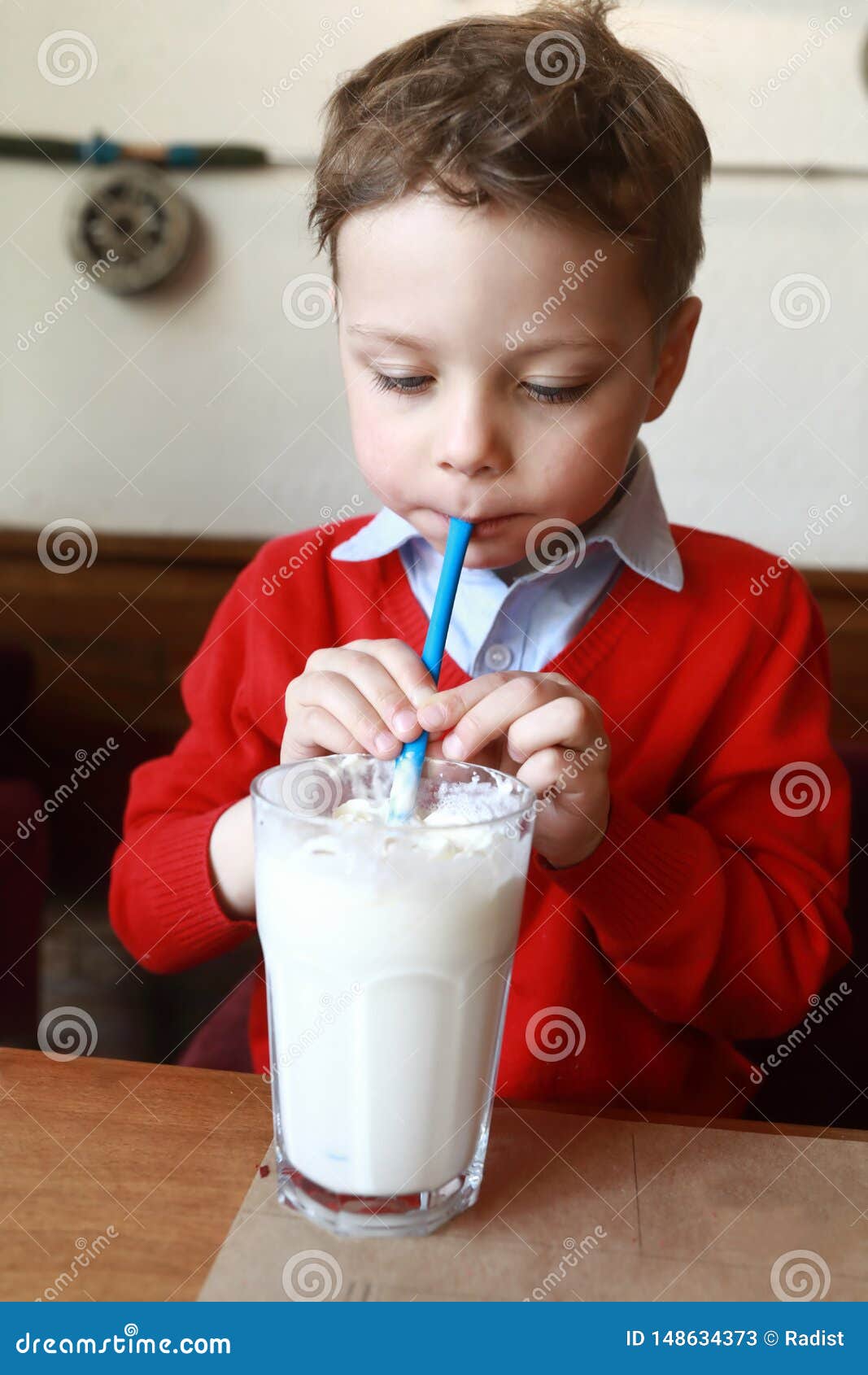 Boy drinking milkshake stock image. Image of attractive - 148634373