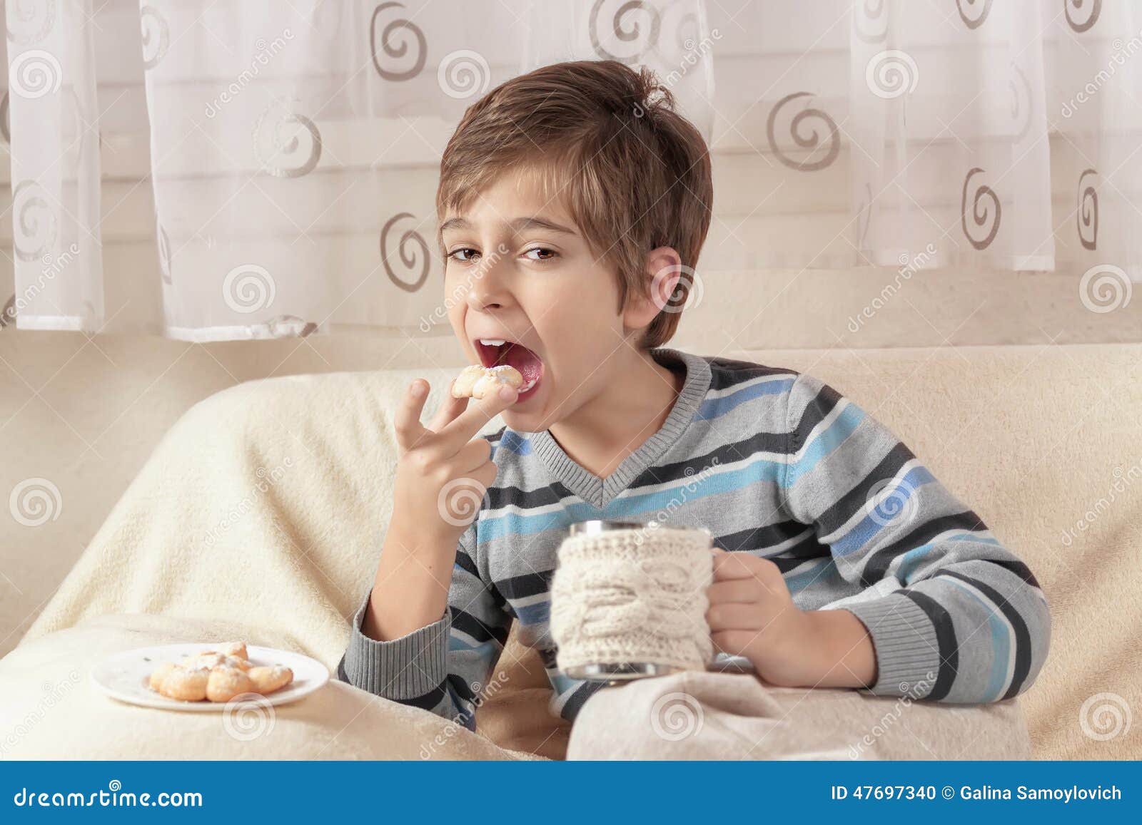 Boy Drinking Tea and Eating Biscuits. Stock Photo - Image of child ...