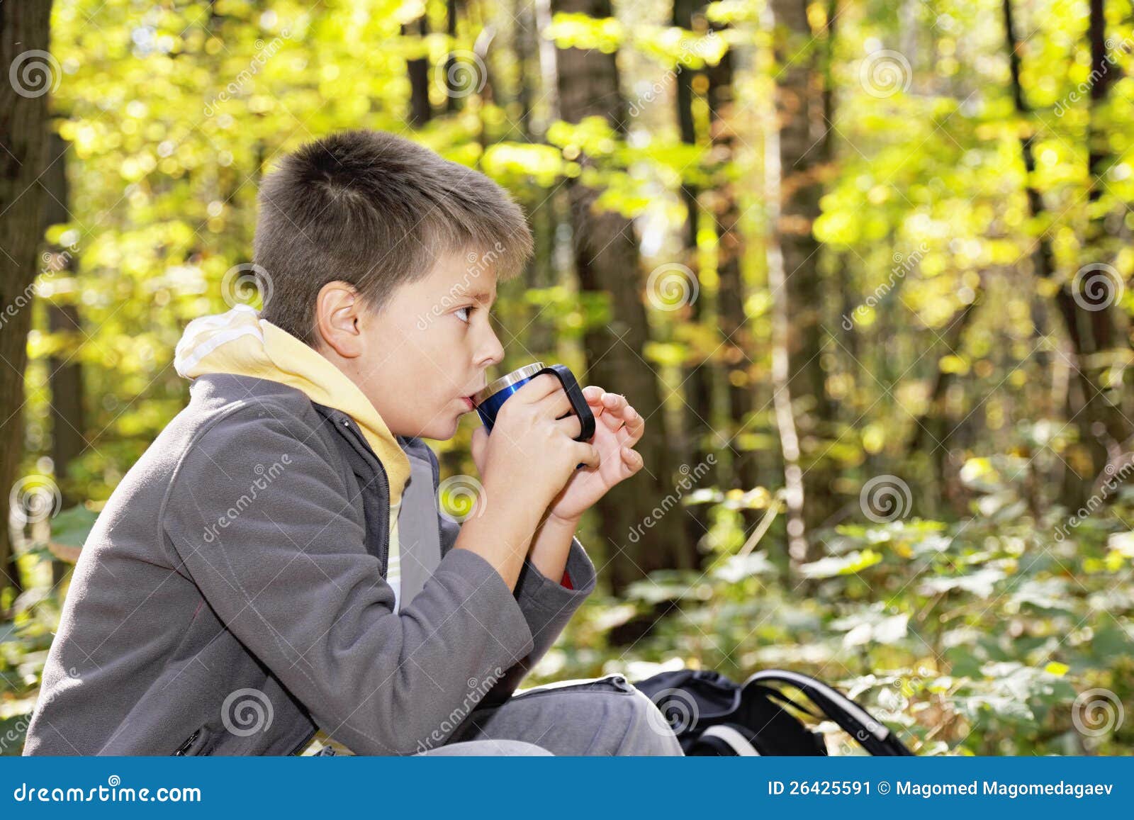 Boy drinks tea stock image. Image of outdoors, horizontal - 26425591