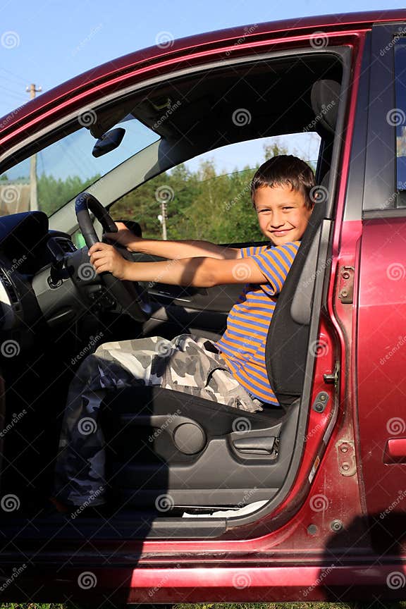 Boy driver in car stock photo. Image of park, outside - 21447100