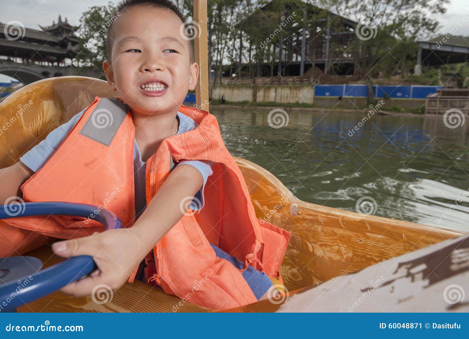 Boy driving boat stock image. Image of childhood, play - 60048871