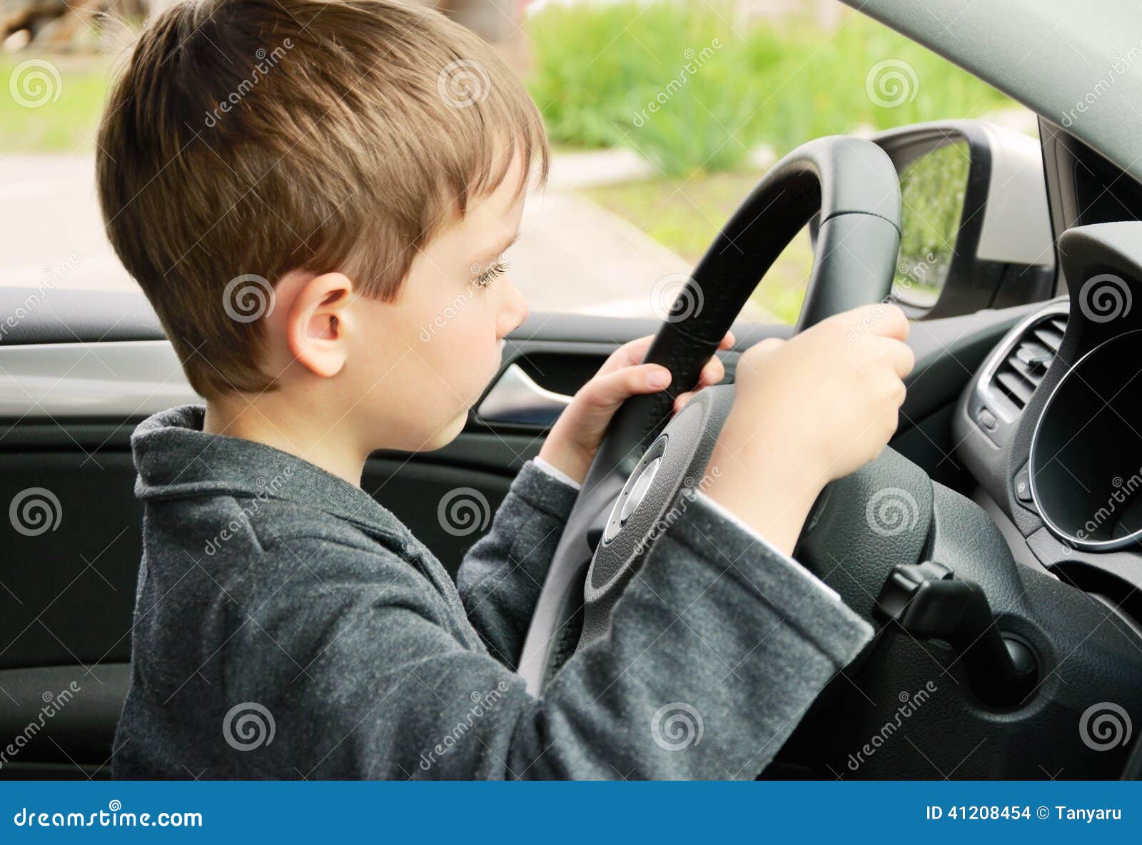 Boy Driving a Car and Looking at the Way Stock Photo - Image of person ... Boy Driving a Car and Looking at the Way Stock Photo - Image of person ...