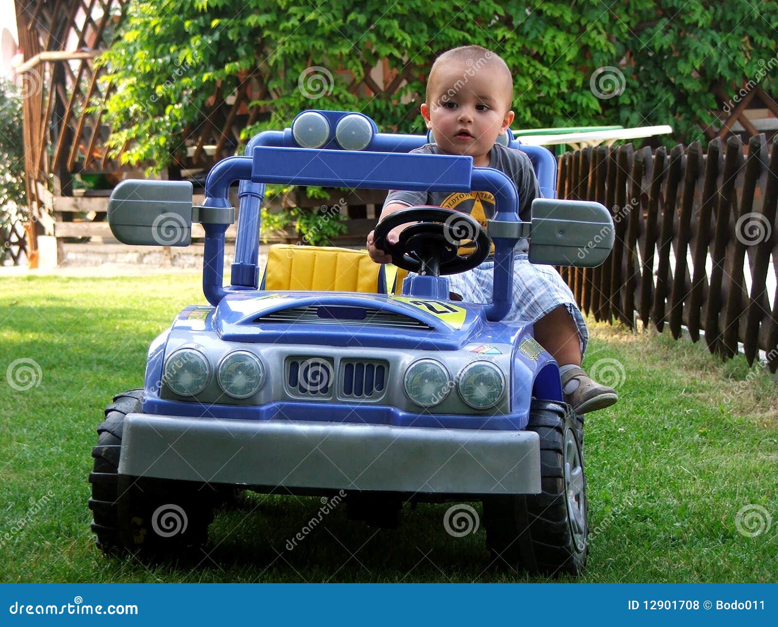 Boy driving a toy car stock photo. Image of baby, carefree - 12901708