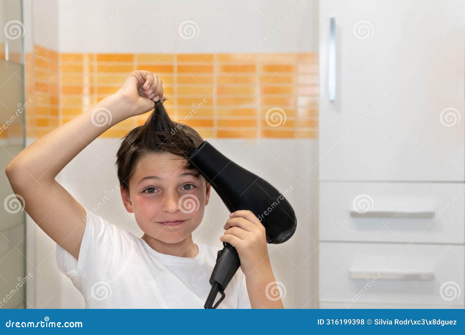 Boy Drying His Hair, Looking at Camera Stock Photo - Image of routine ...