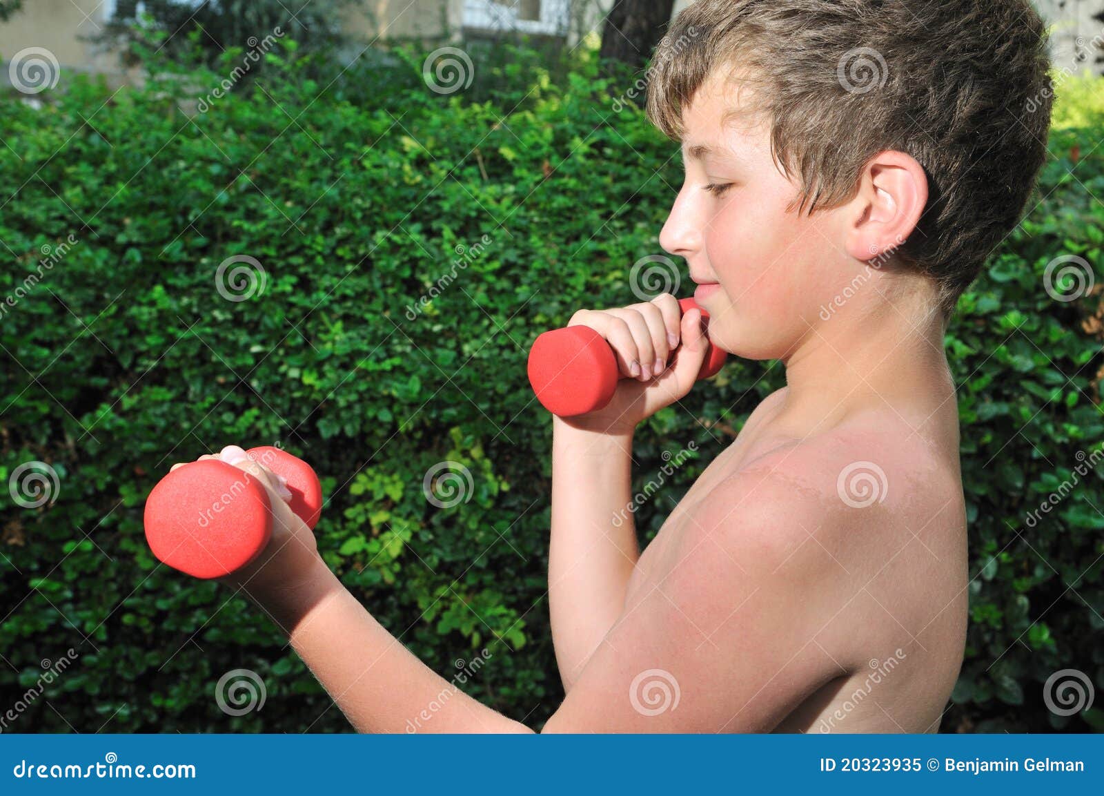 A boy with a dumbbell stock image. Image of fitness, schoolboy - 20323935