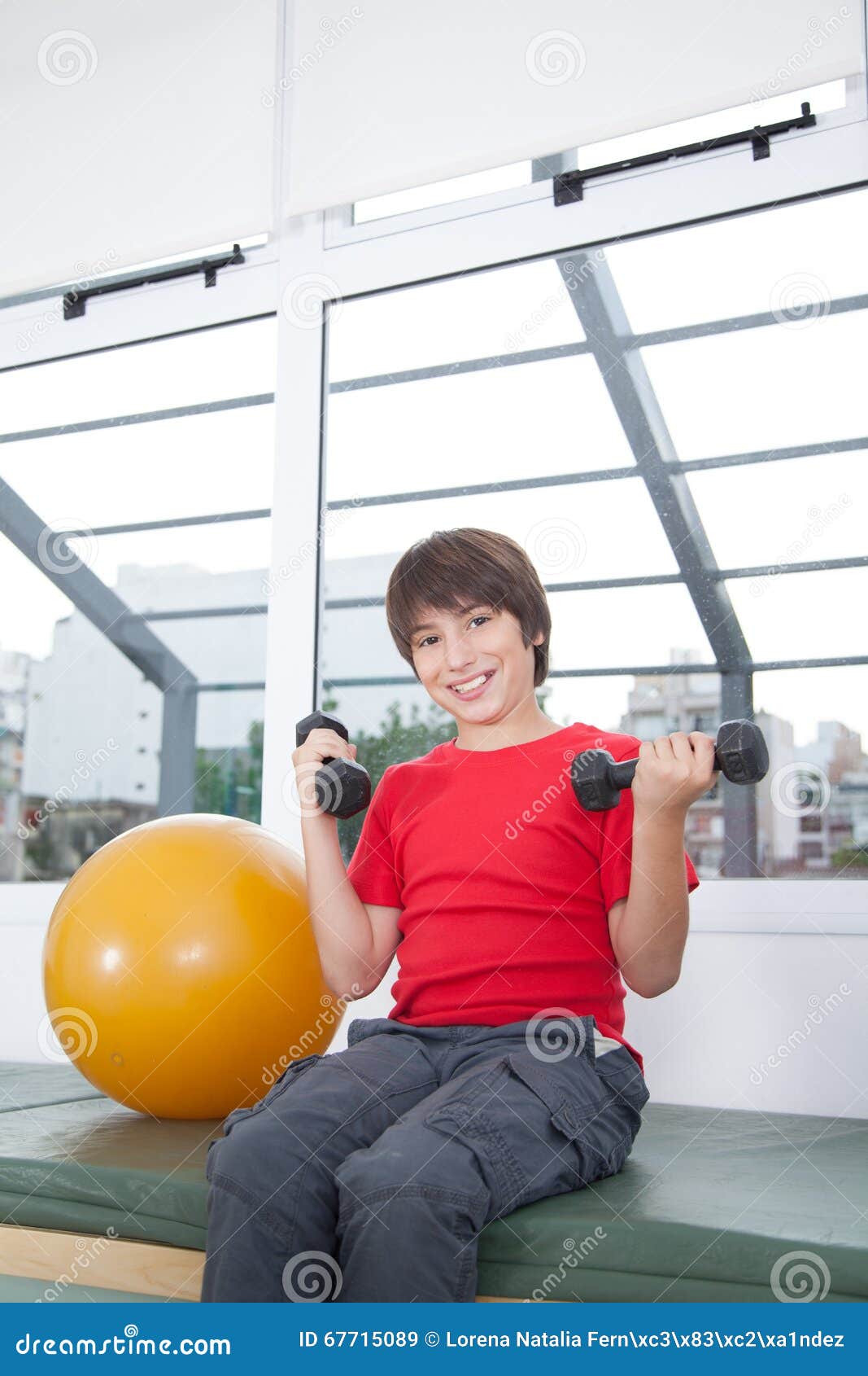 Boy with dumbbells stock image. Image of physiotherapy - 67715089