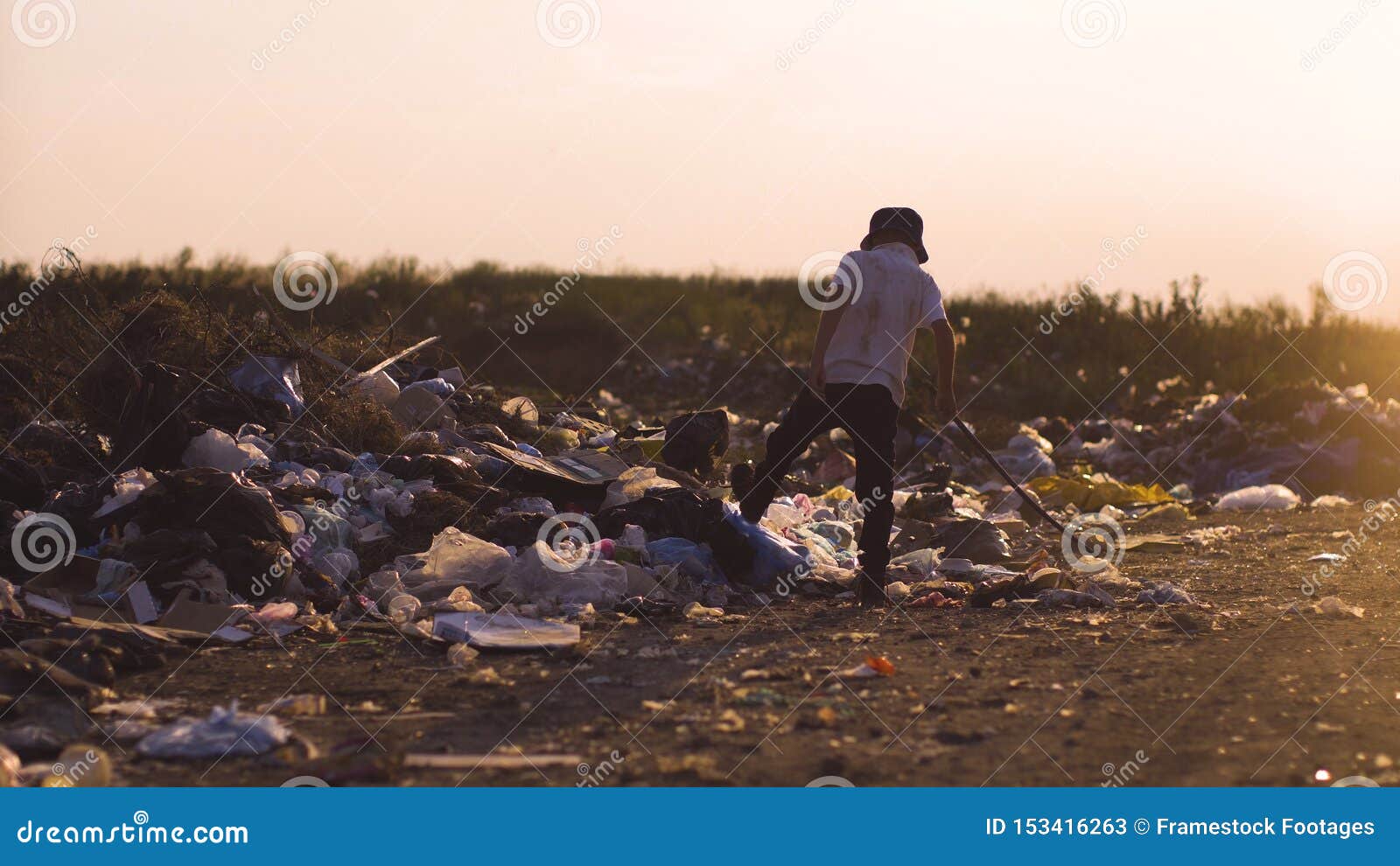 Boy in dump stock image. Image of dust, backlit, kicking - 153416263
