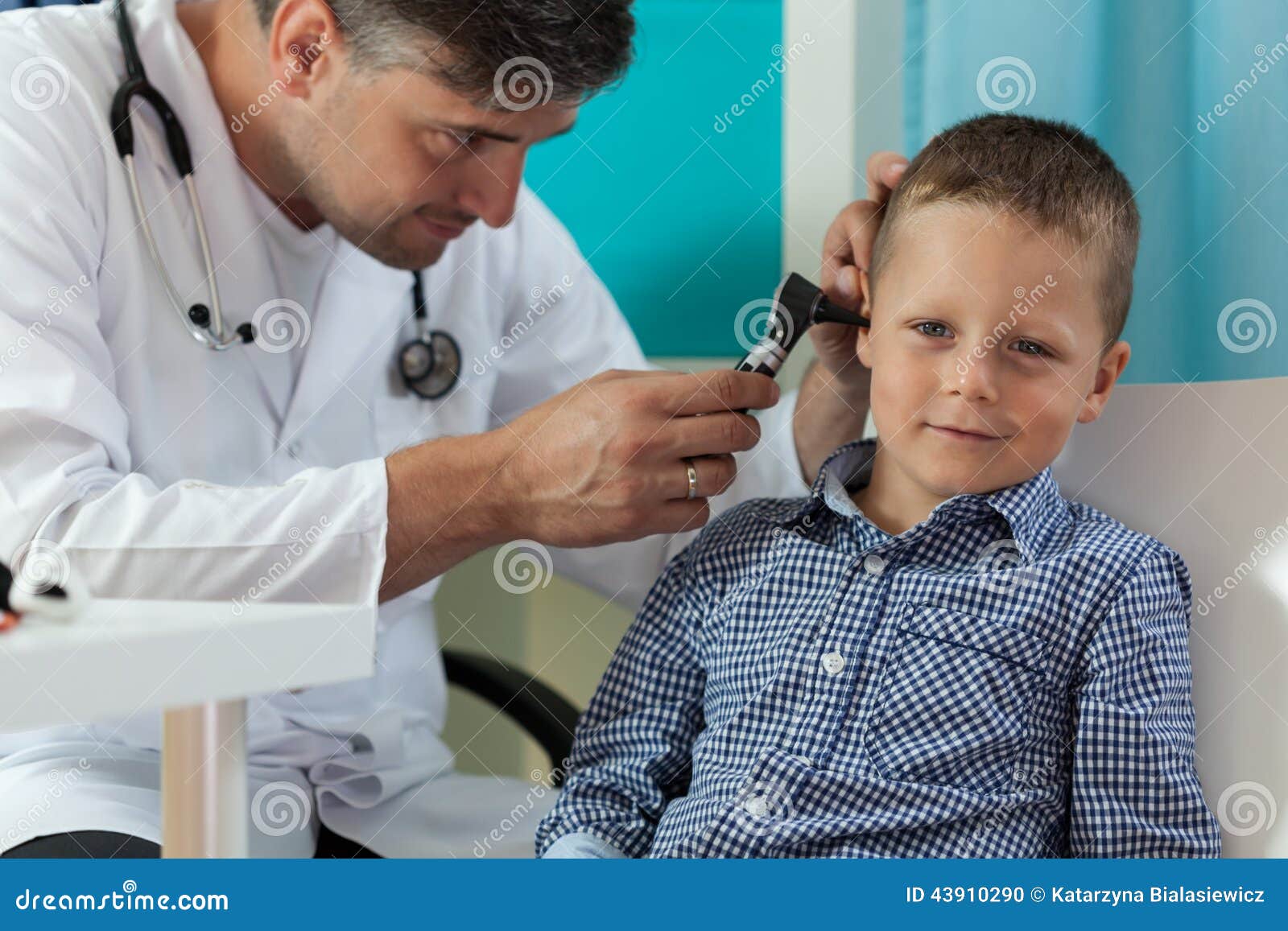 Boy during ear examination stock photo. Image of physician - 43910290