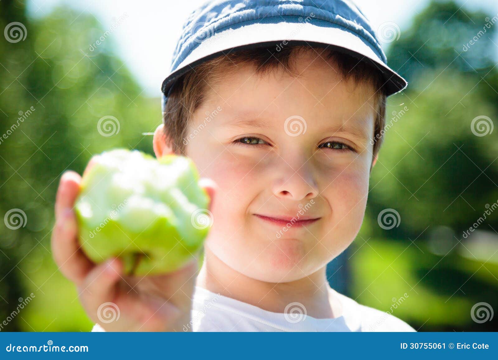 Boy eating an apple stock image. Image of childhood, green - 30755061