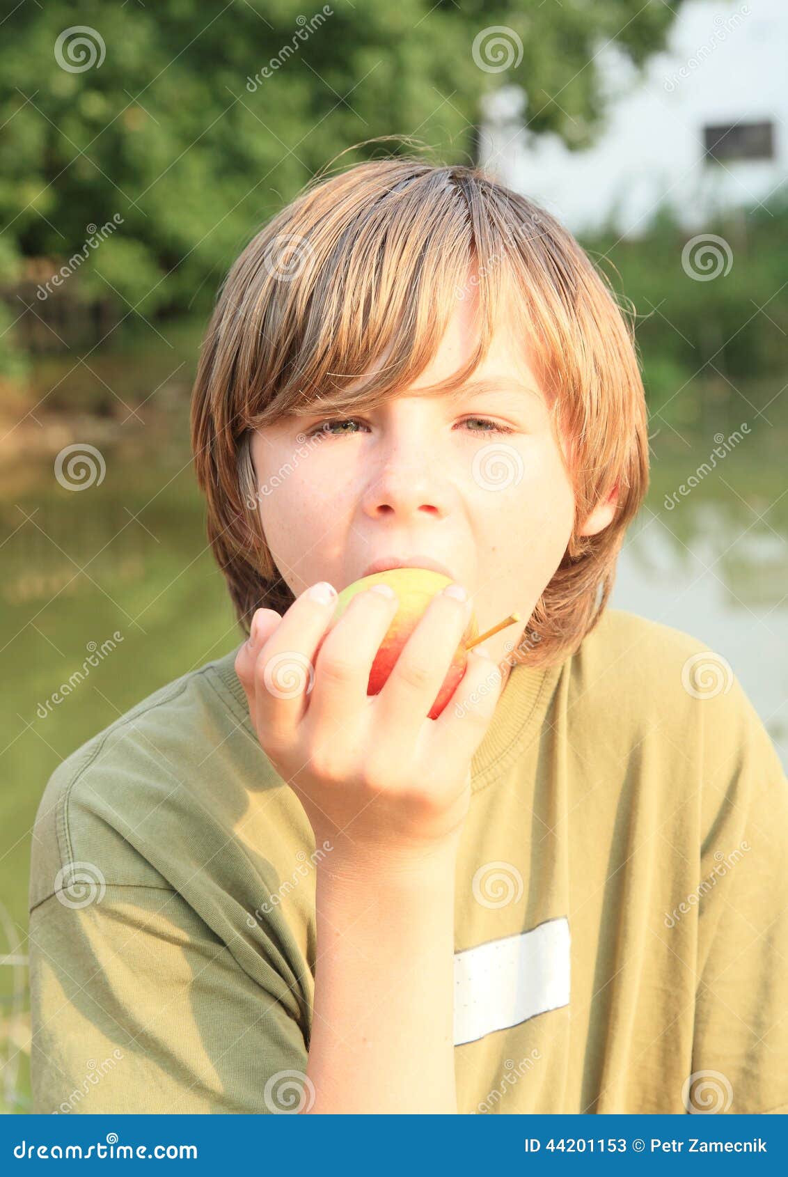 Boy eating an apple stock image. Image of apple, biting - 44201153