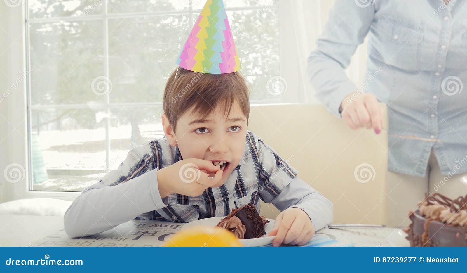 Boy eating birthday cake. stock image. Image of child - 87239277