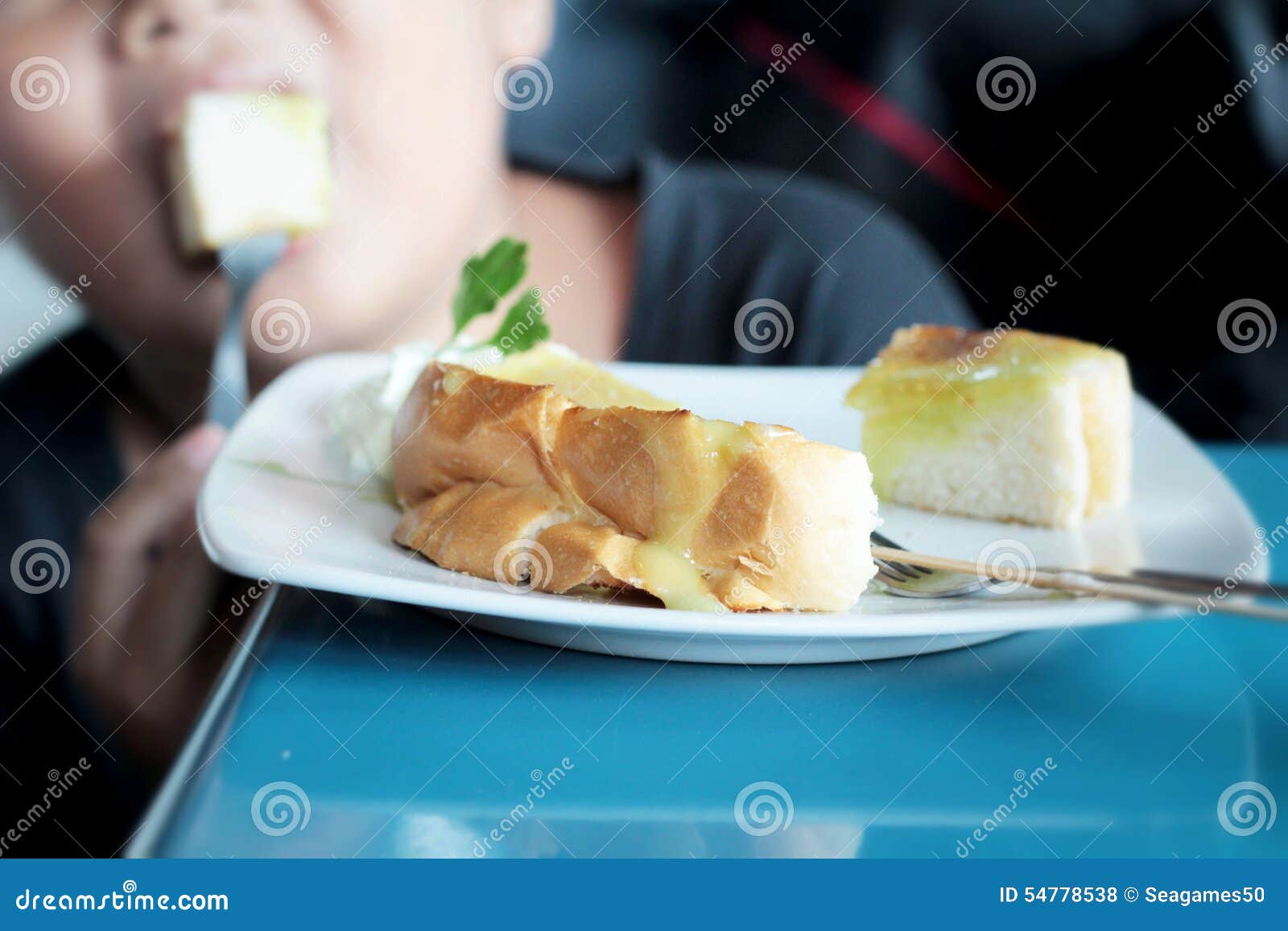The Boy Eating Bread, Butter, Topped with Custard Delicious Stock Photo ...