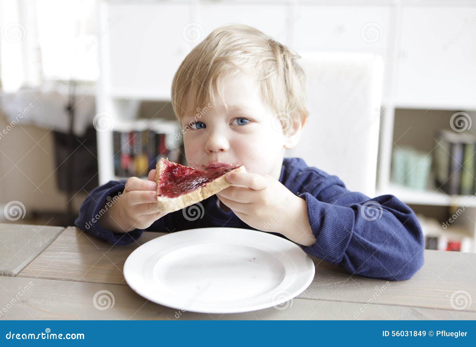Boy eating bread and jam stock image. Image of snack - 56031849