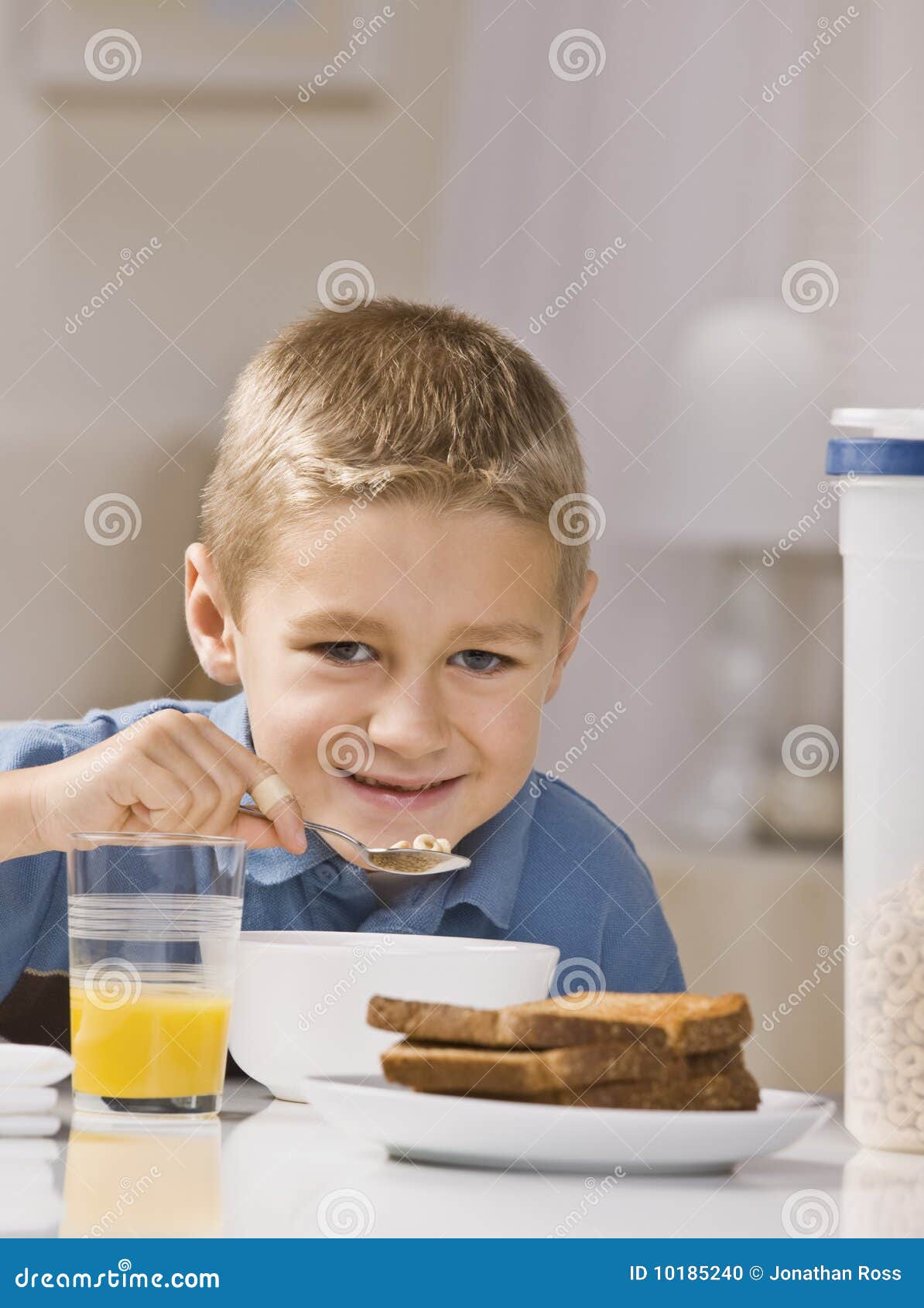 Boy Eating Breakfast stock photo. Image of cheerful, male - 10185240