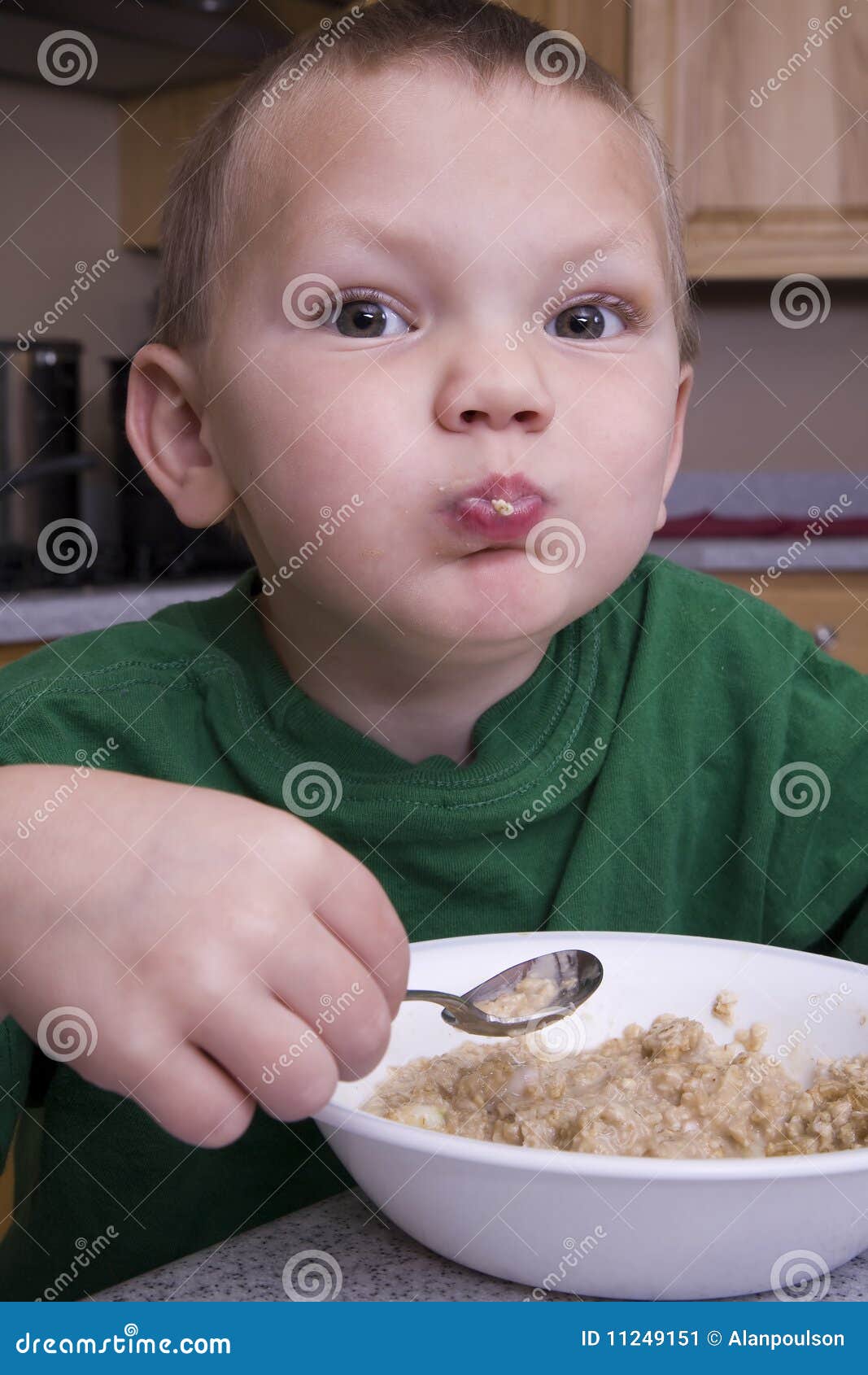 Boy eating breakfast stock image. Image of mouth, morning - 11249151