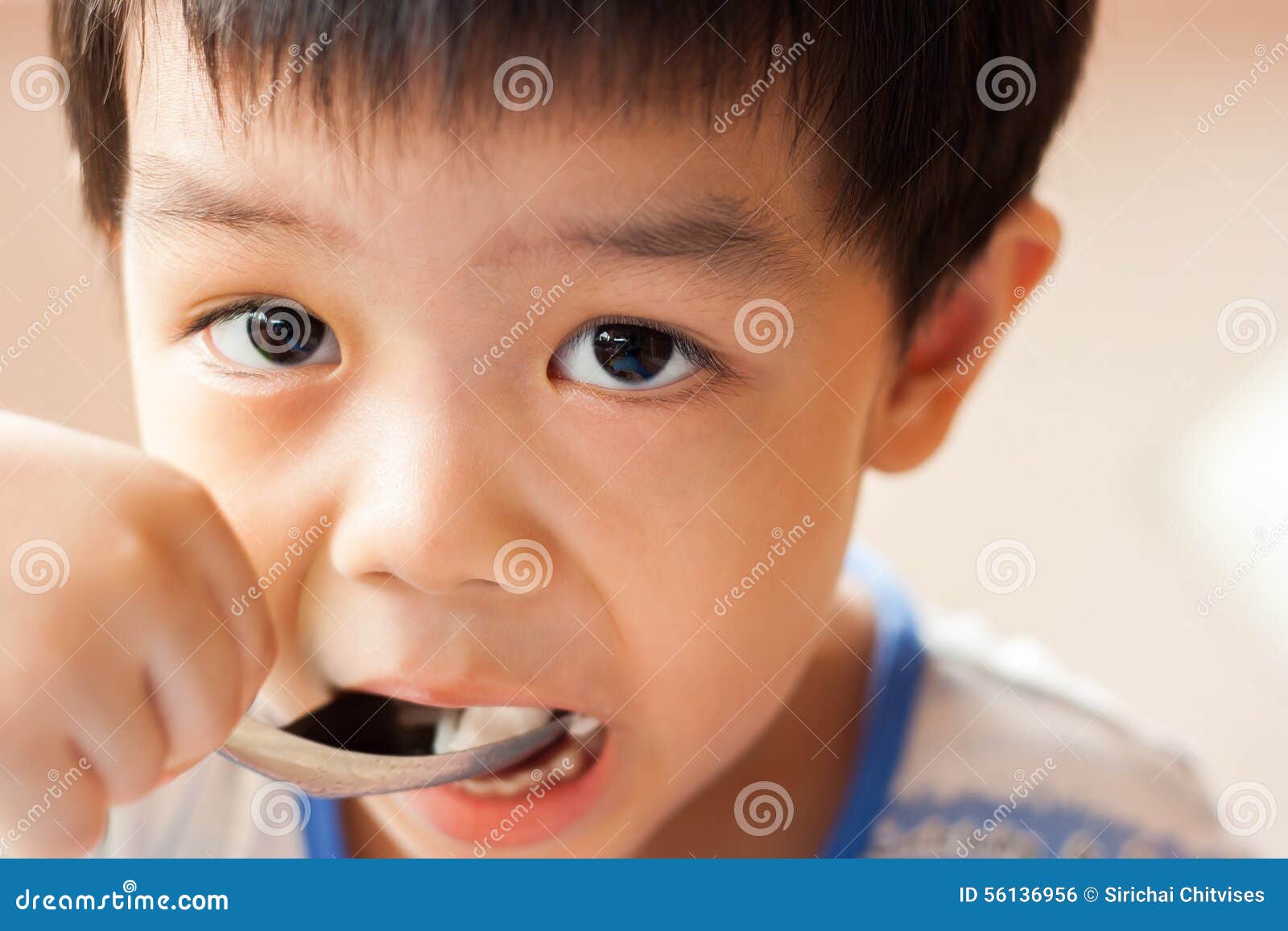 The boy is eating. stock photo. Image of hungry, food - 56136956