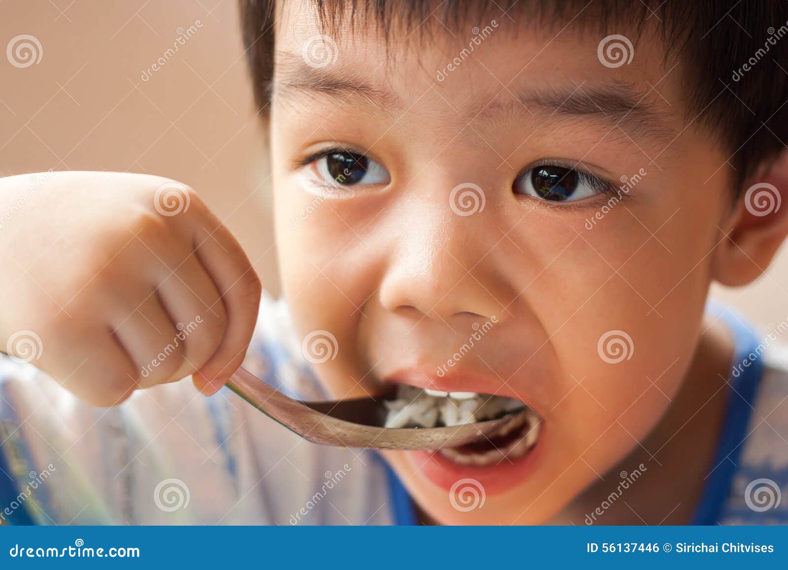 The boy is eating stock photo. Image of eating, rice - 56137446