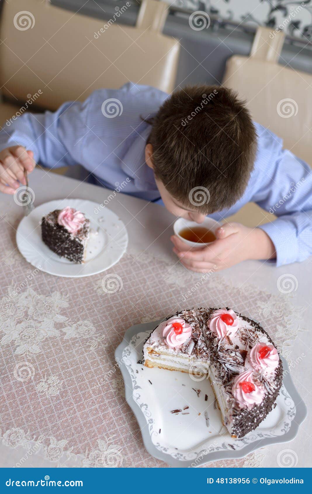 Boy eating cake at table stock photo. Image of fresh - 48138956
