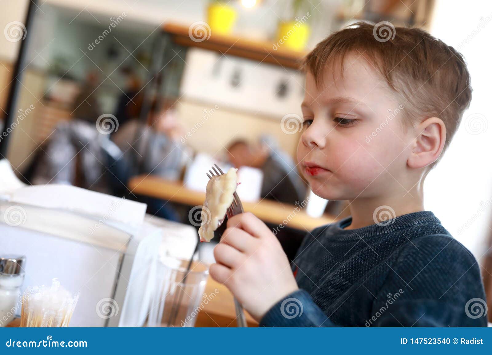Boy Eating Cherry Dumplings Stock Photo - Image of childhood, diner ...