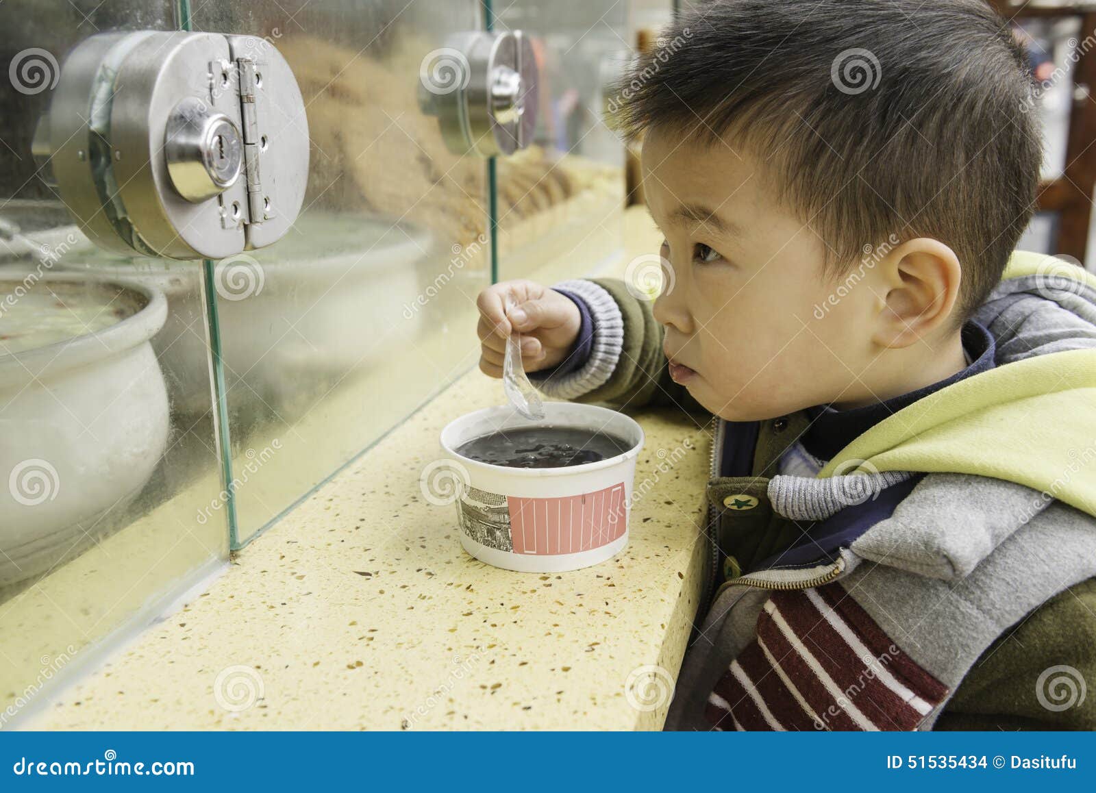 Boy Eating Congee Stock Photo | CartoonDealer.com #51535434