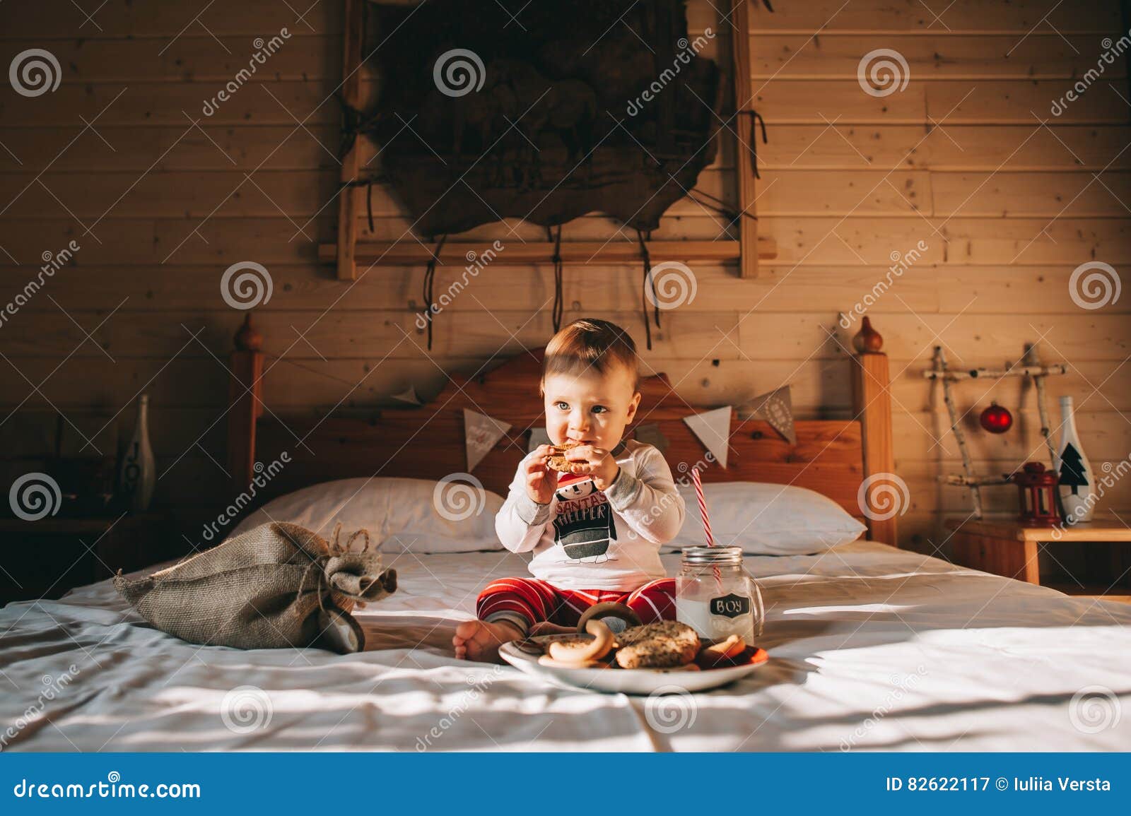 Boy eating cookies in bed stock image. Image of child - 82622117