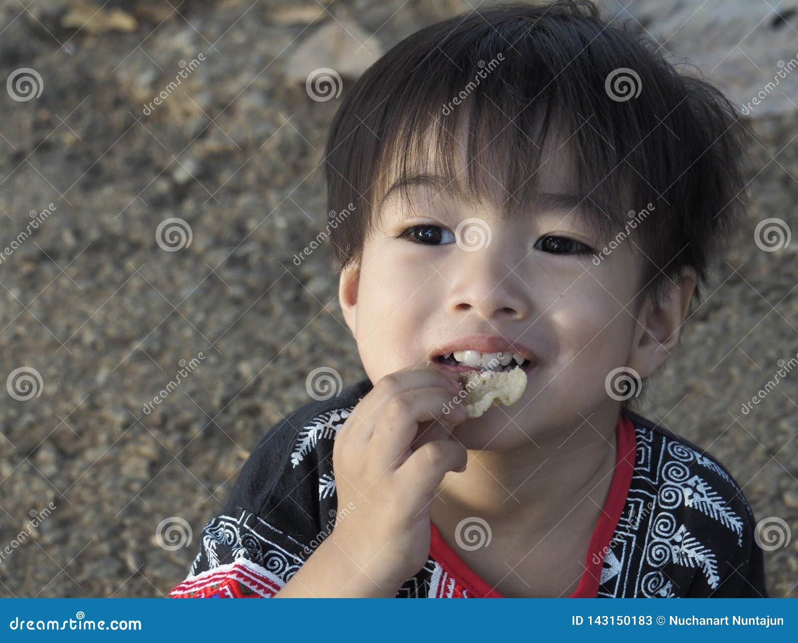 The Boy is Eating a Crispy Snack. Stock Image - Image of face, smiling ...