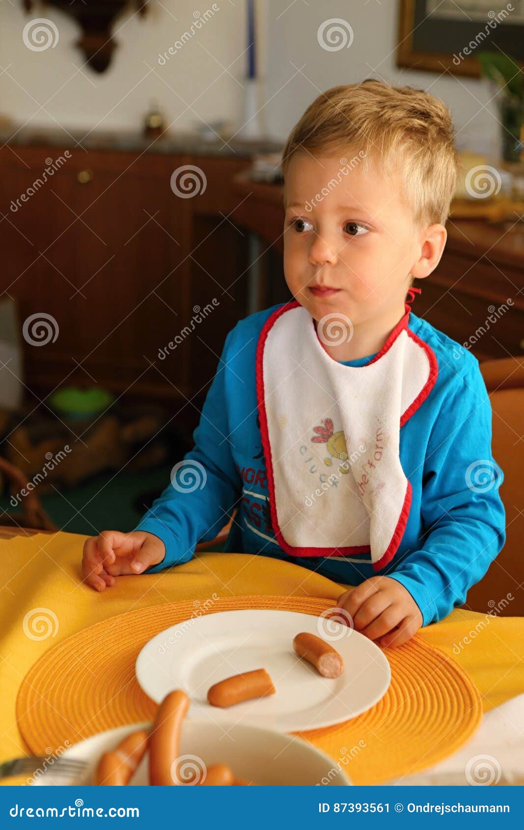 Boy Eating Frankfurters from the White Plate Stock Image - Image of ...