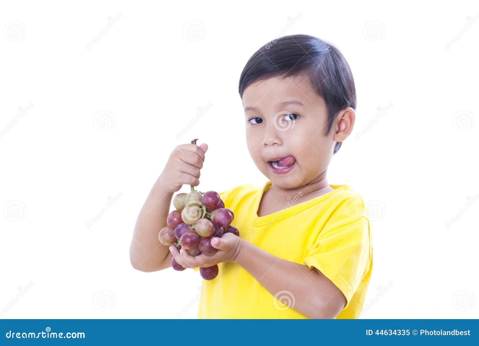 Boy eating grapes stock image. Image of flavour, taste - 44634335