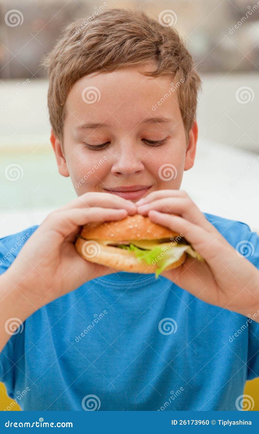 Boy eating hamburger stock photo. Image of issue, beggar - 26173960