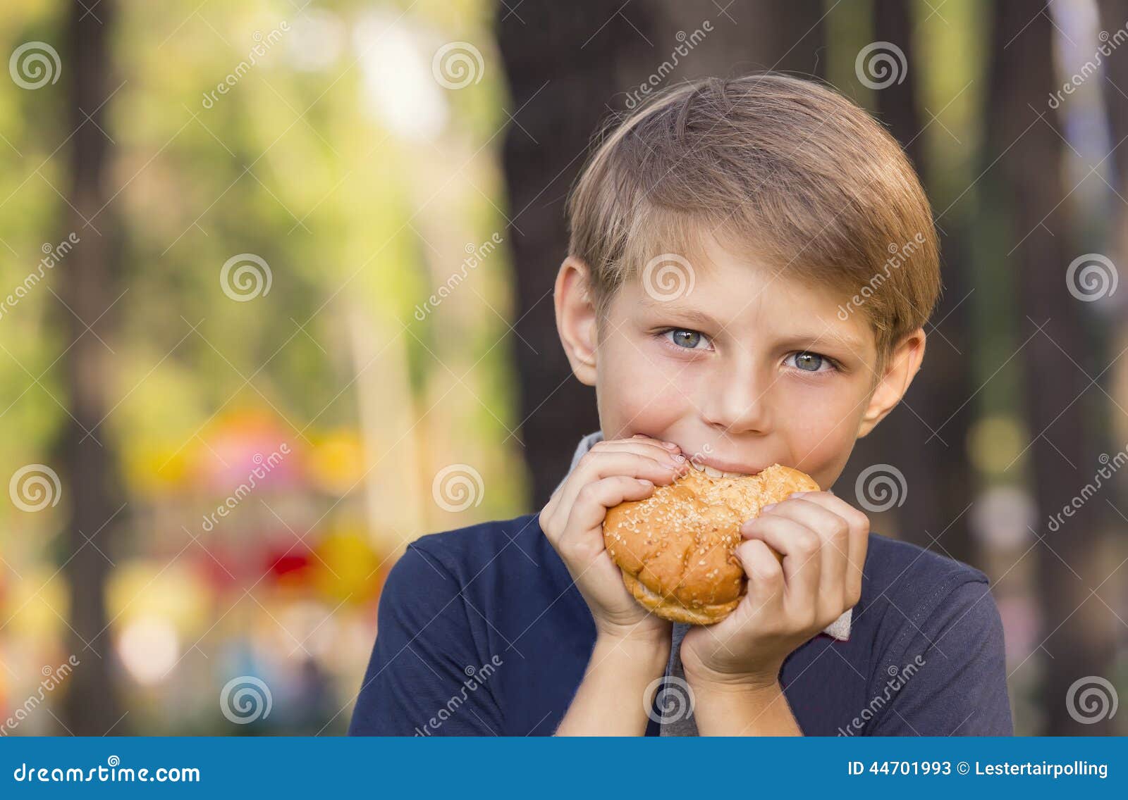 Boy eating a hamburger stock image. Image of bread, kids - 44701993