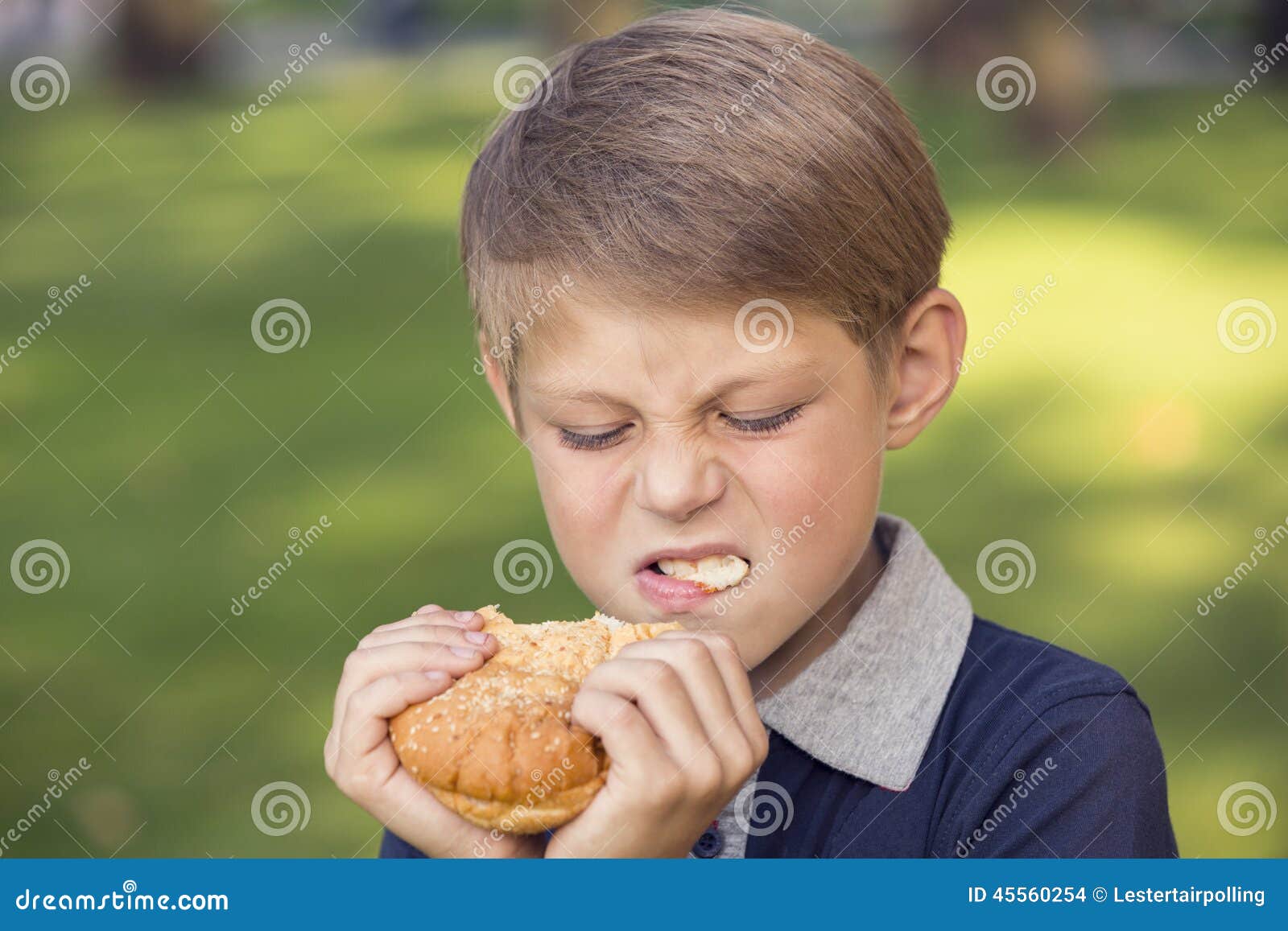 Boy eating a hamburger stock photo. Image of baking, people - 45560254