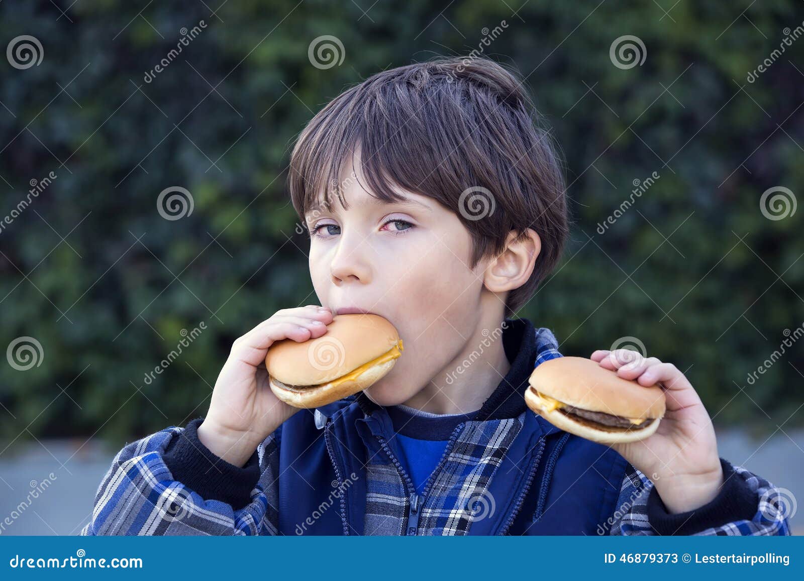 Boy eating a hamburger stock image. Image of european - 46879373