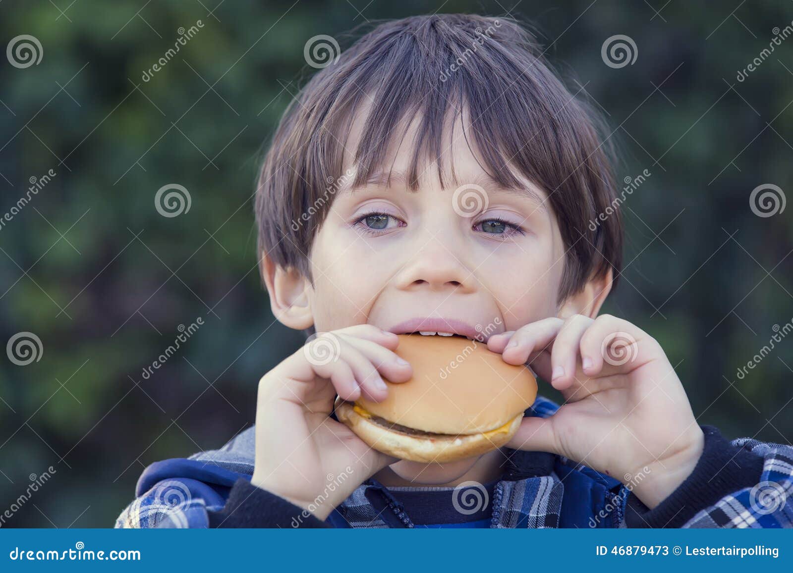 Boy eating a hamburger stock image. Image of male, baking - 46879473