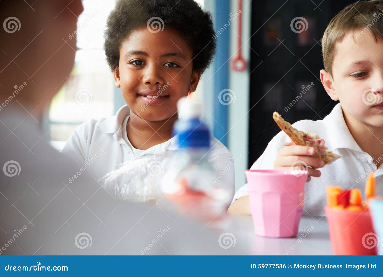 Boy Eating Healthy Packed Lunch in School Cafeteria Stock Photo - Image ...